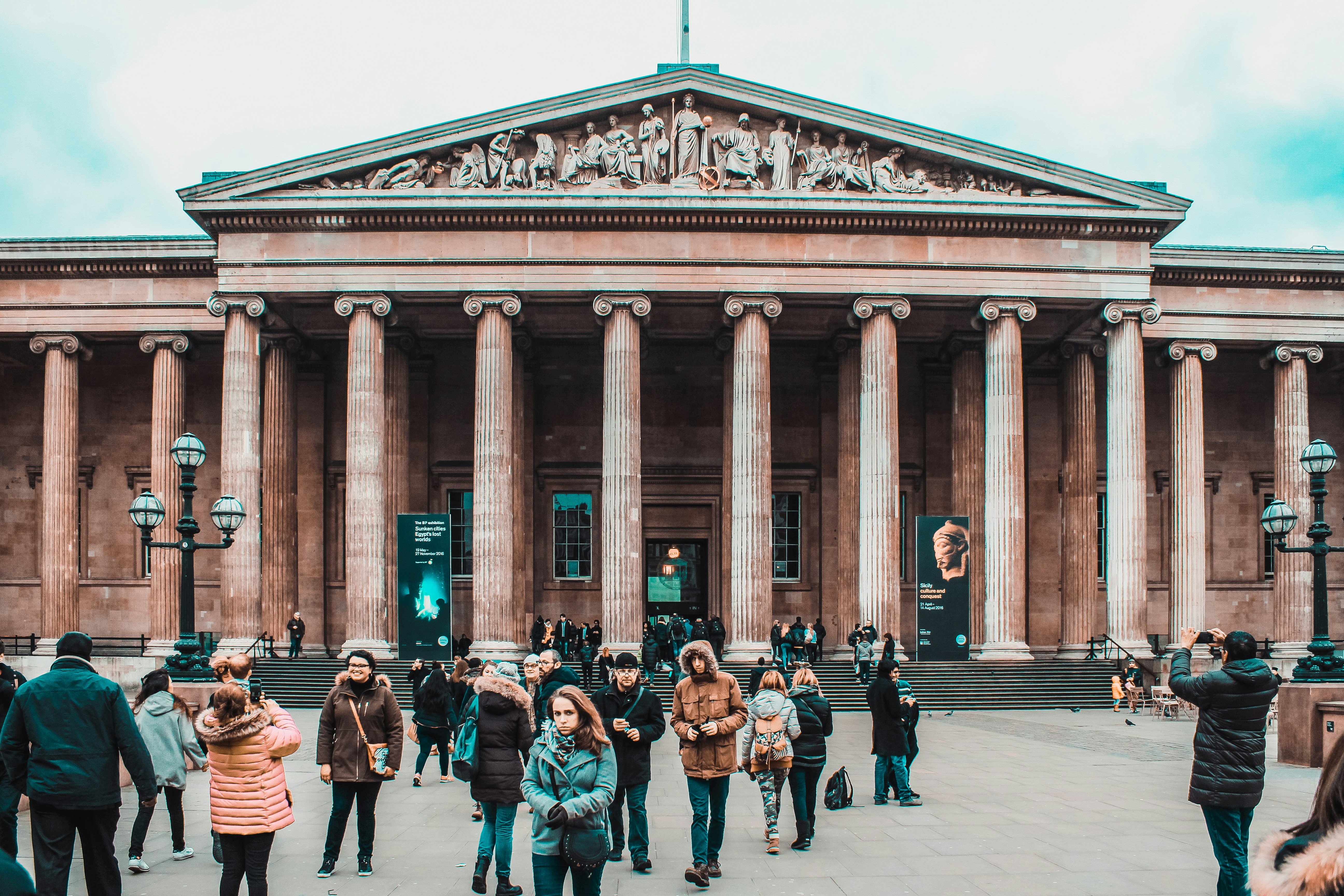 Steps to a Grand Entrance: A Bustling Plaza in Front of a Historic Museum