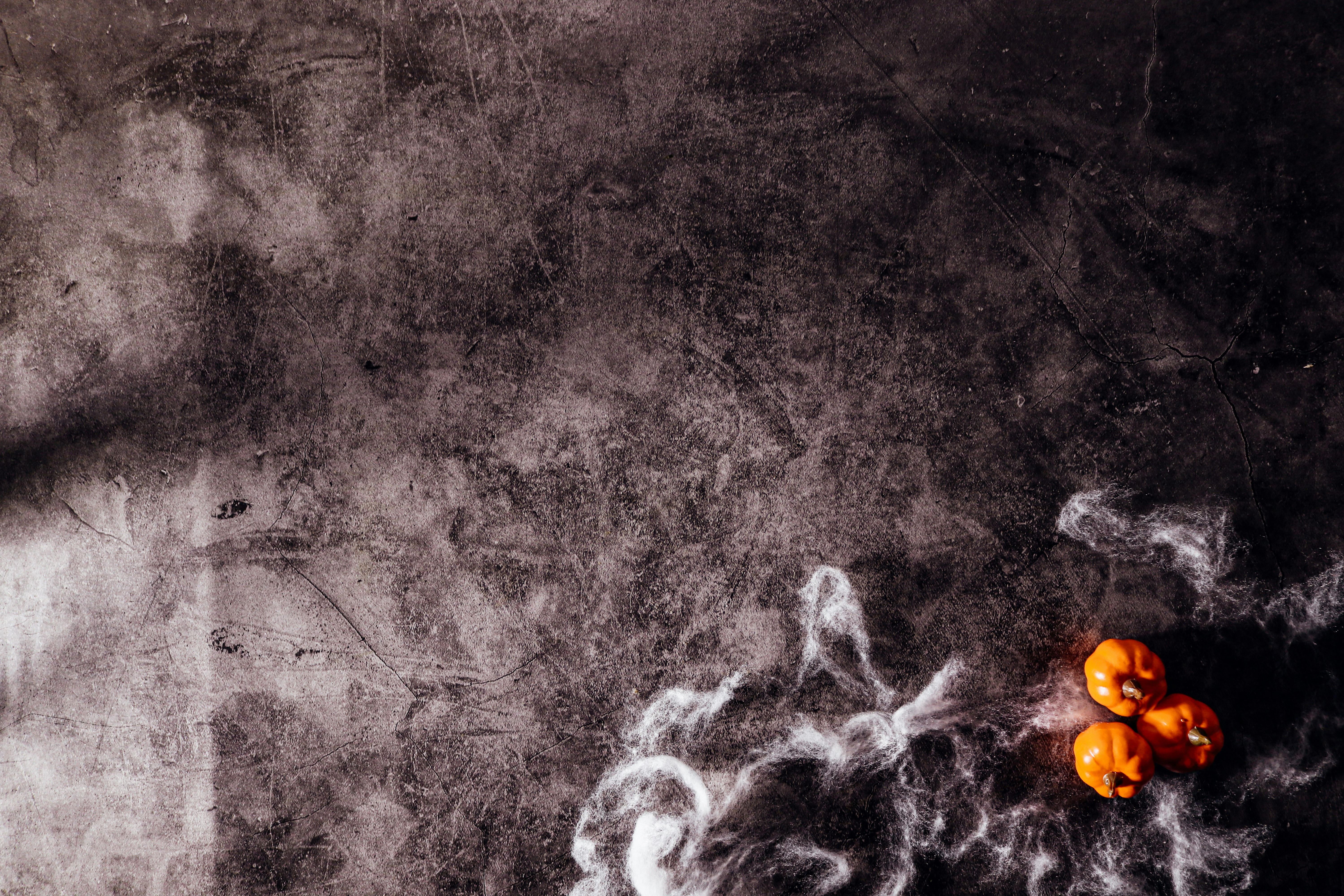 Three Orange Pips in a Plume of Smoke on Charcoal Slate