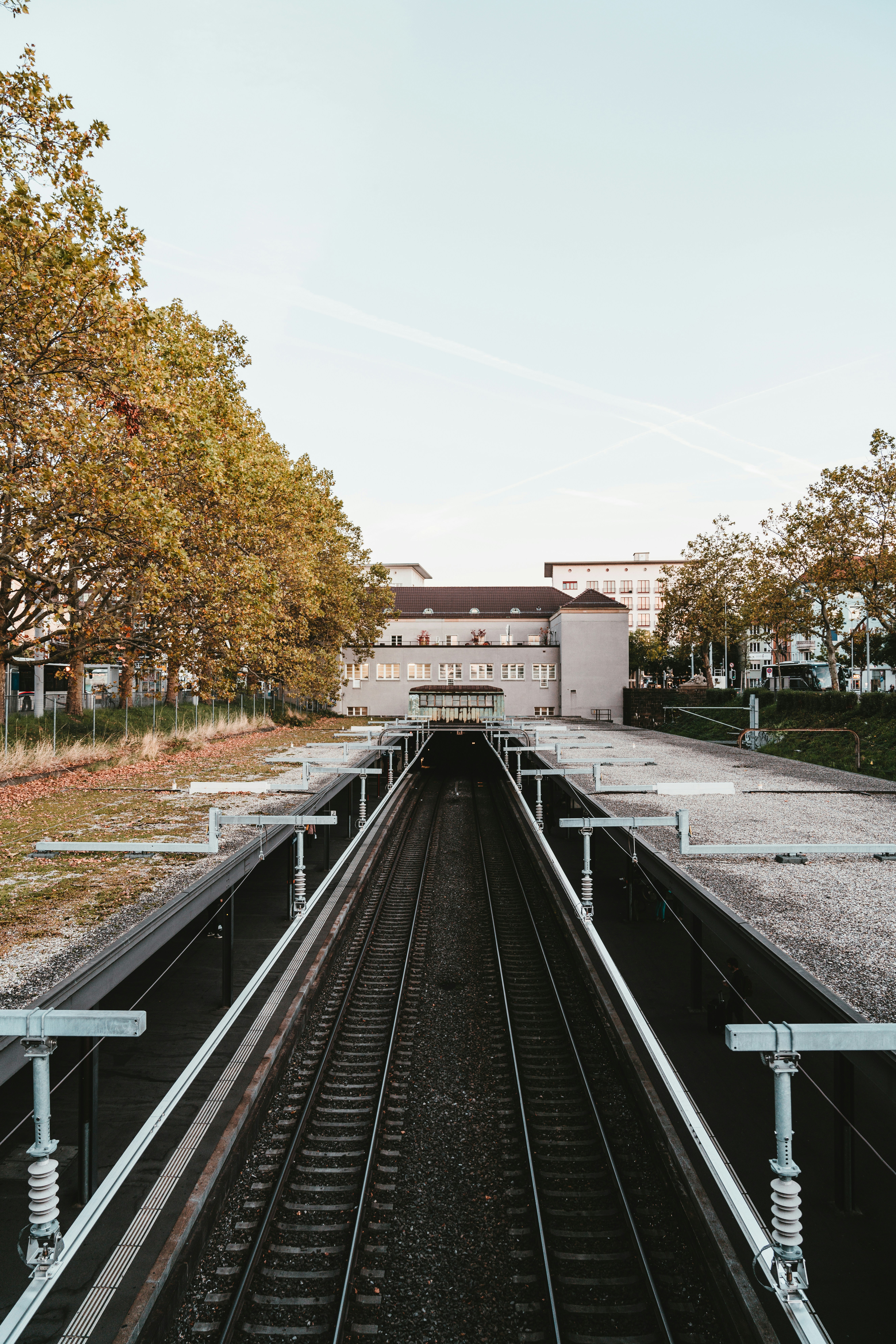a train track with a building in the background