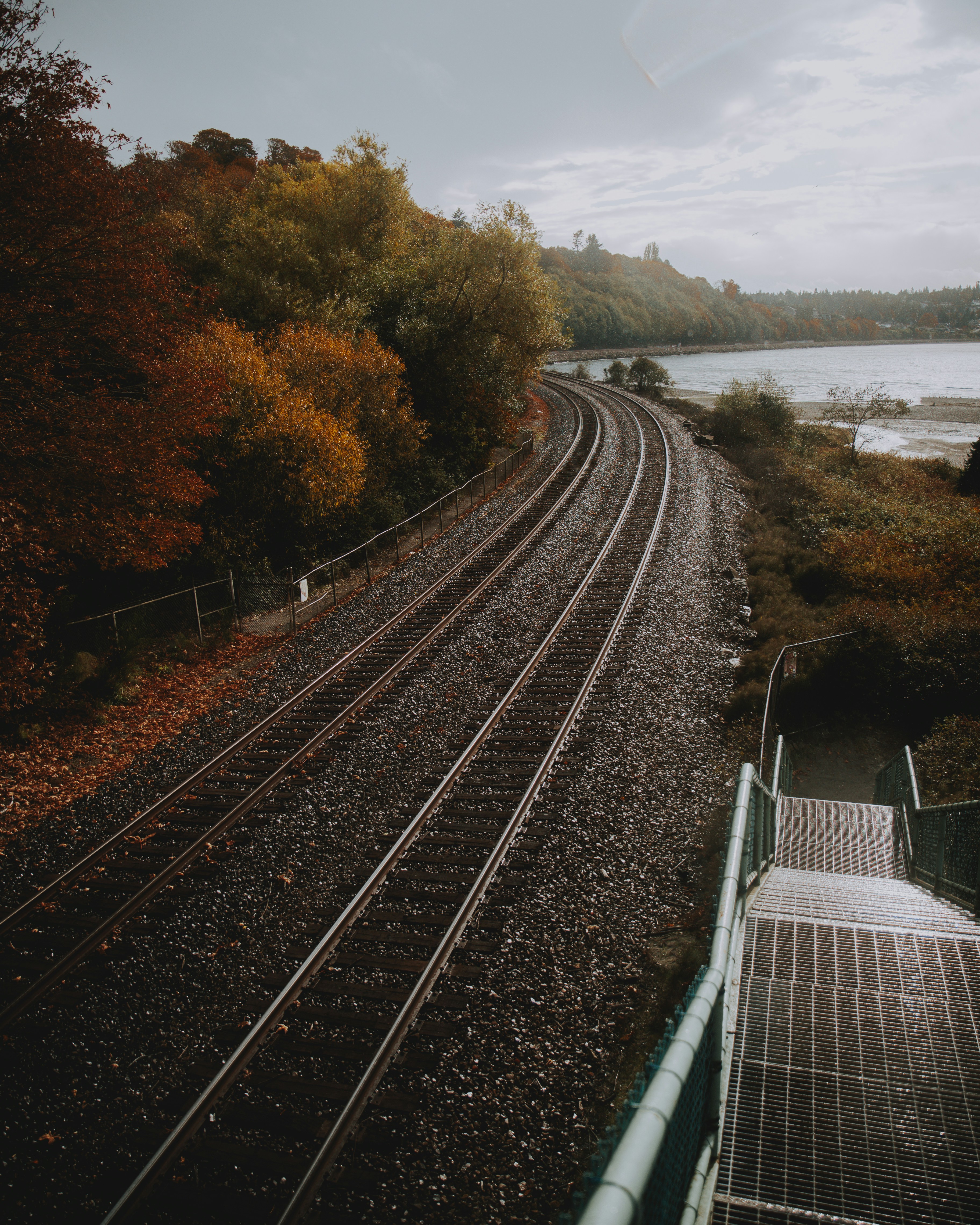 Empty train track near shore at daytime photo – Free Railroad tracks ...