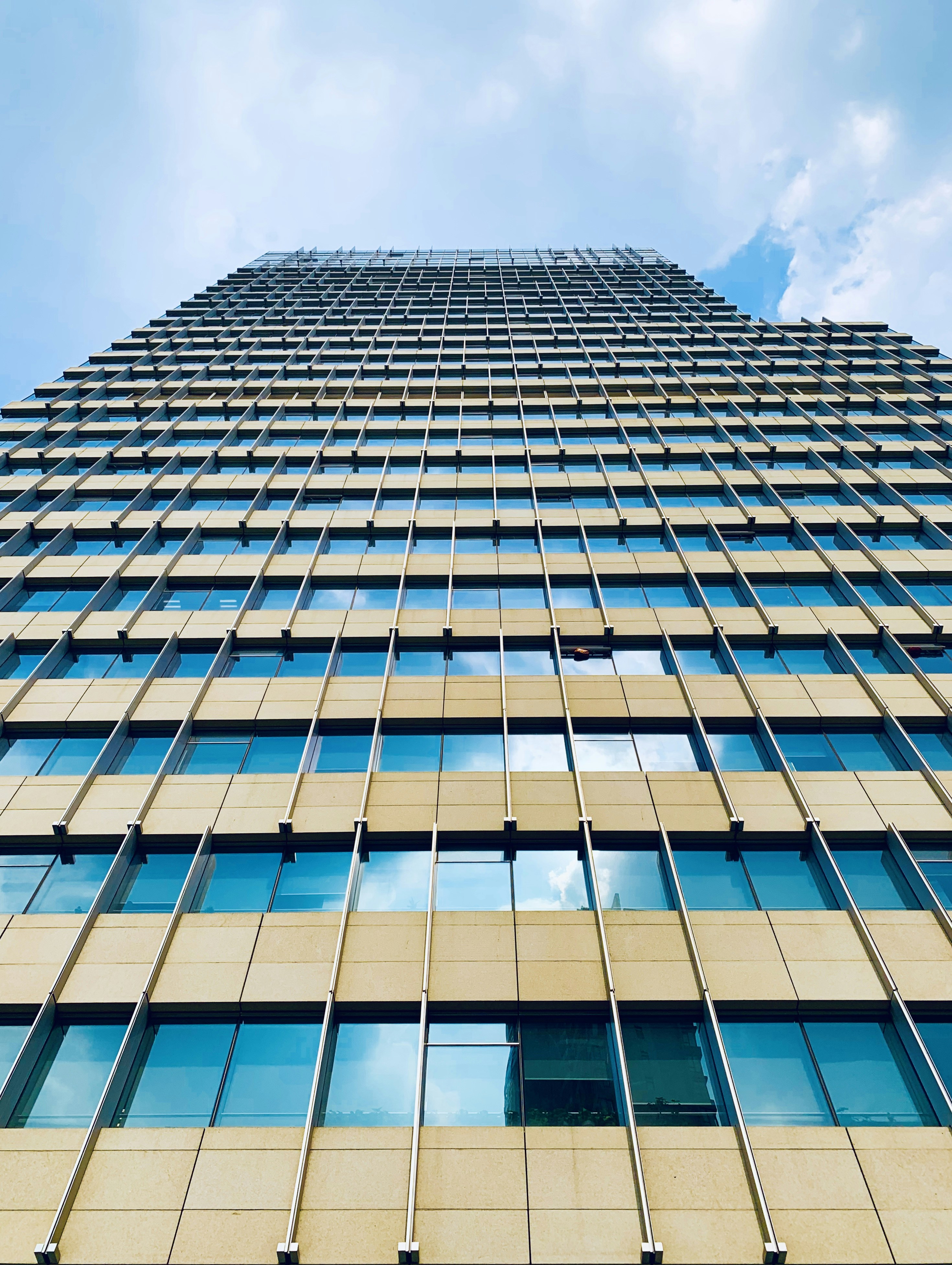 Worm view photo of brown building under cloudy sky photo – Free ...