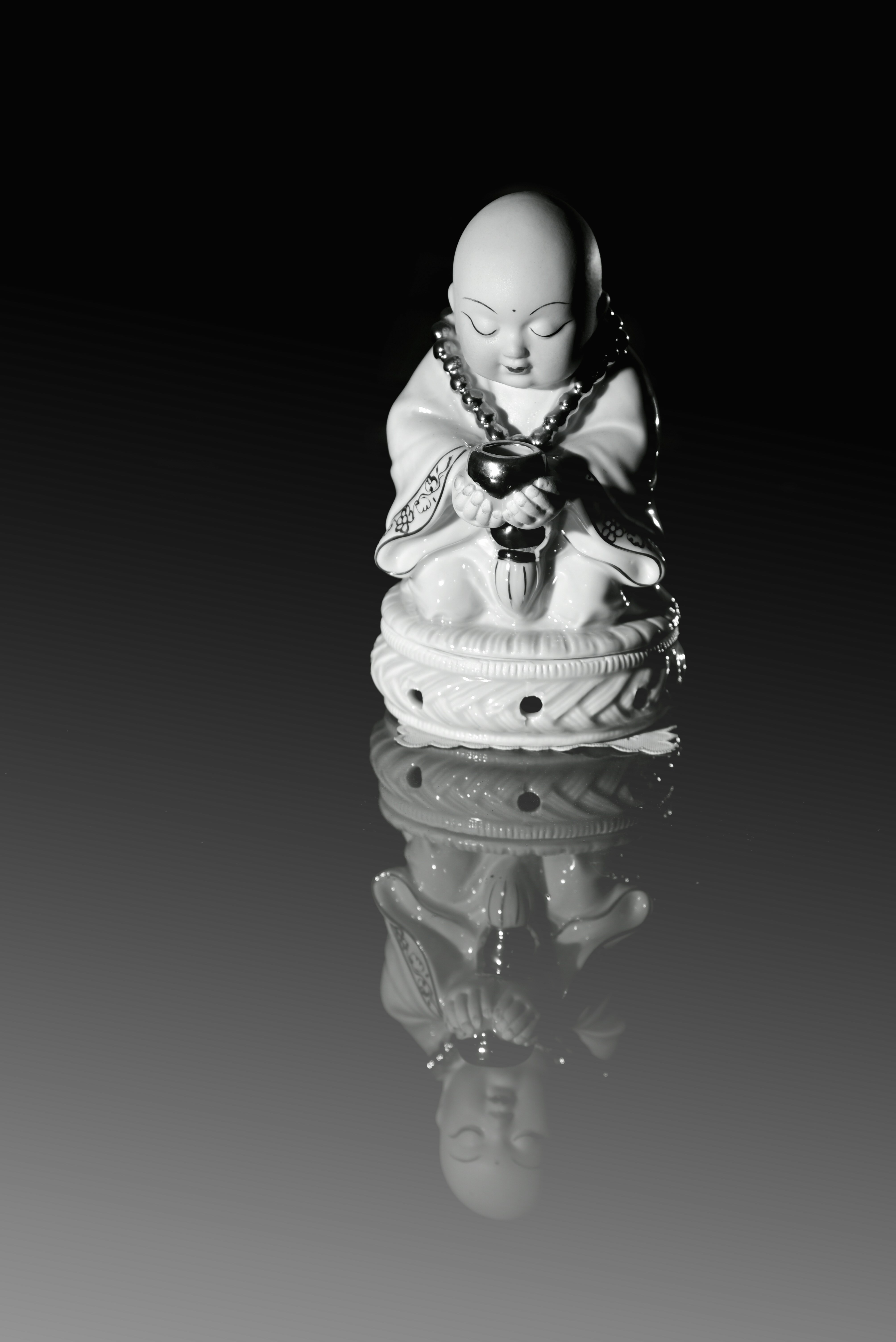 Porcelain Monk in Gradient Noir: Quiet Reflection