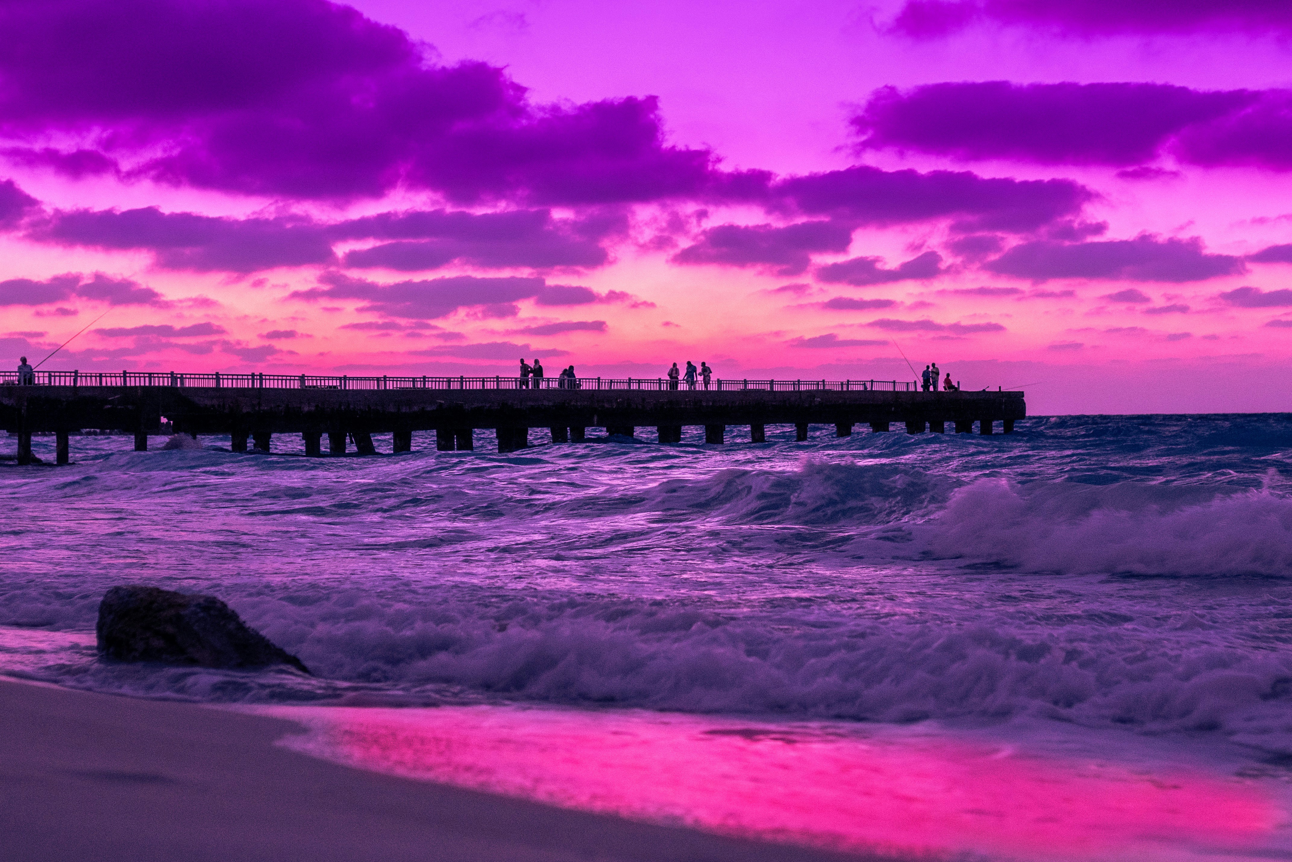 Neon-Tinted Pier: silhouettes against a violet horizon