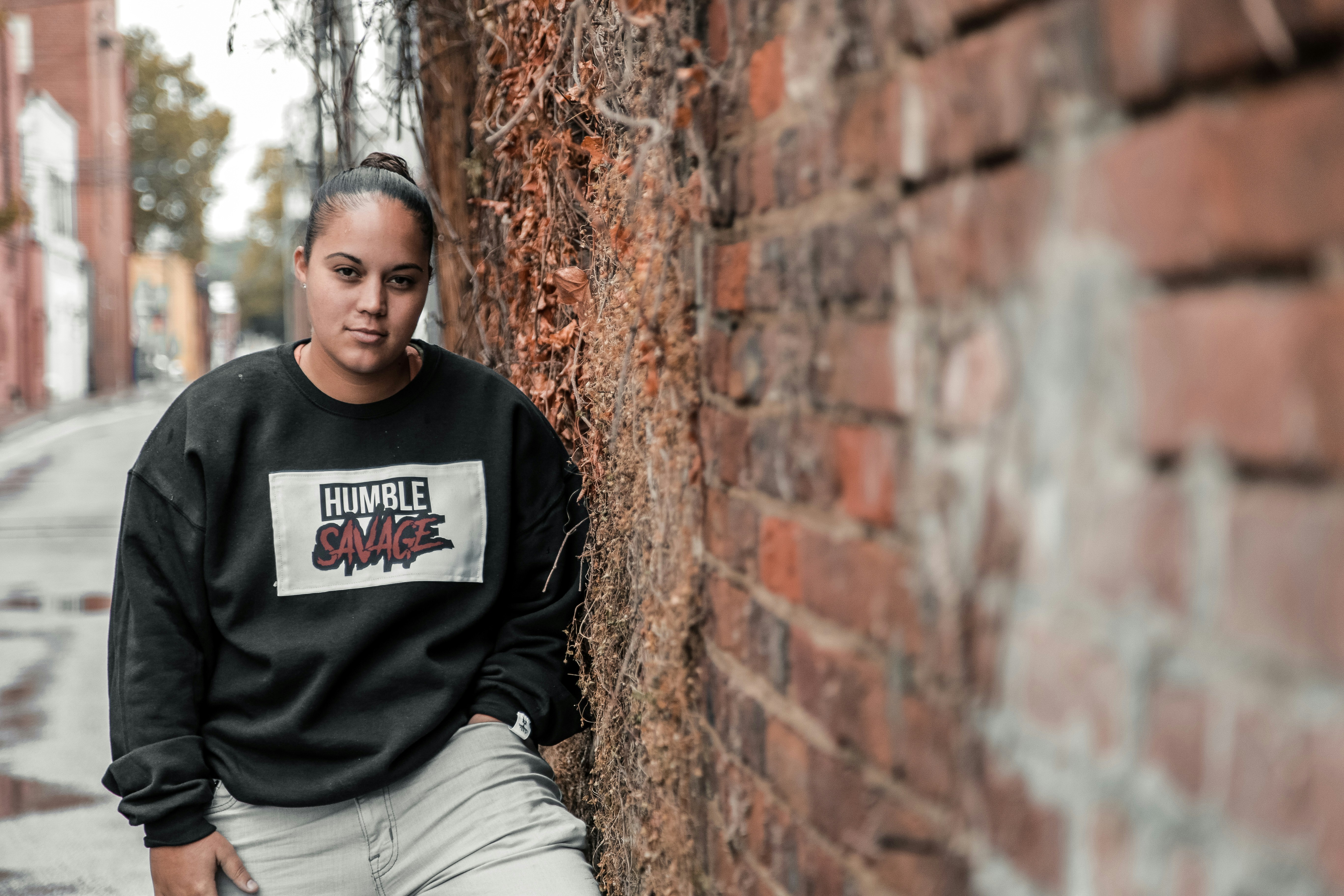 Urban Street Portrait: Quiet Confidence by the Brick Wall