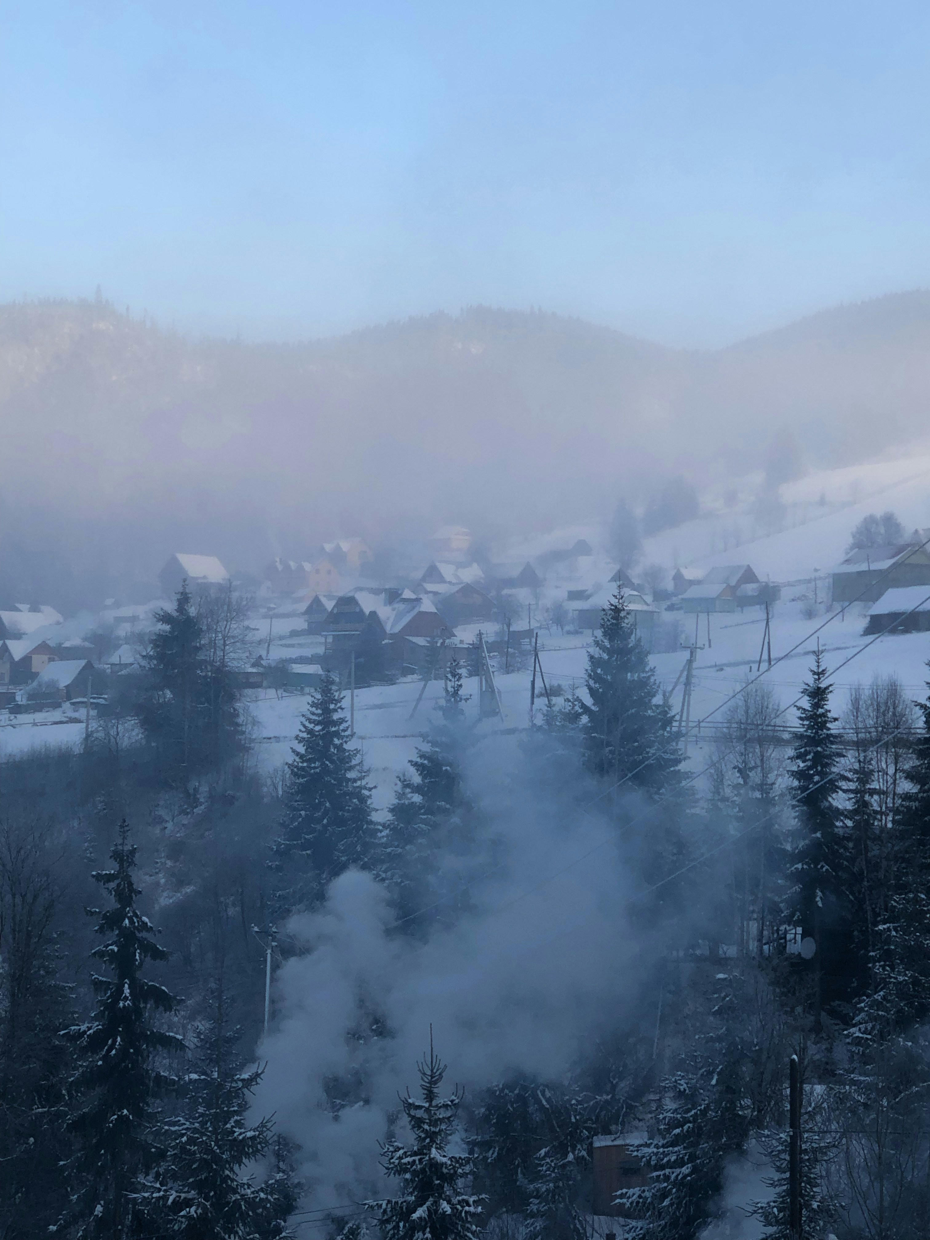 Morning Veil Over a Snowbound Mountain Village