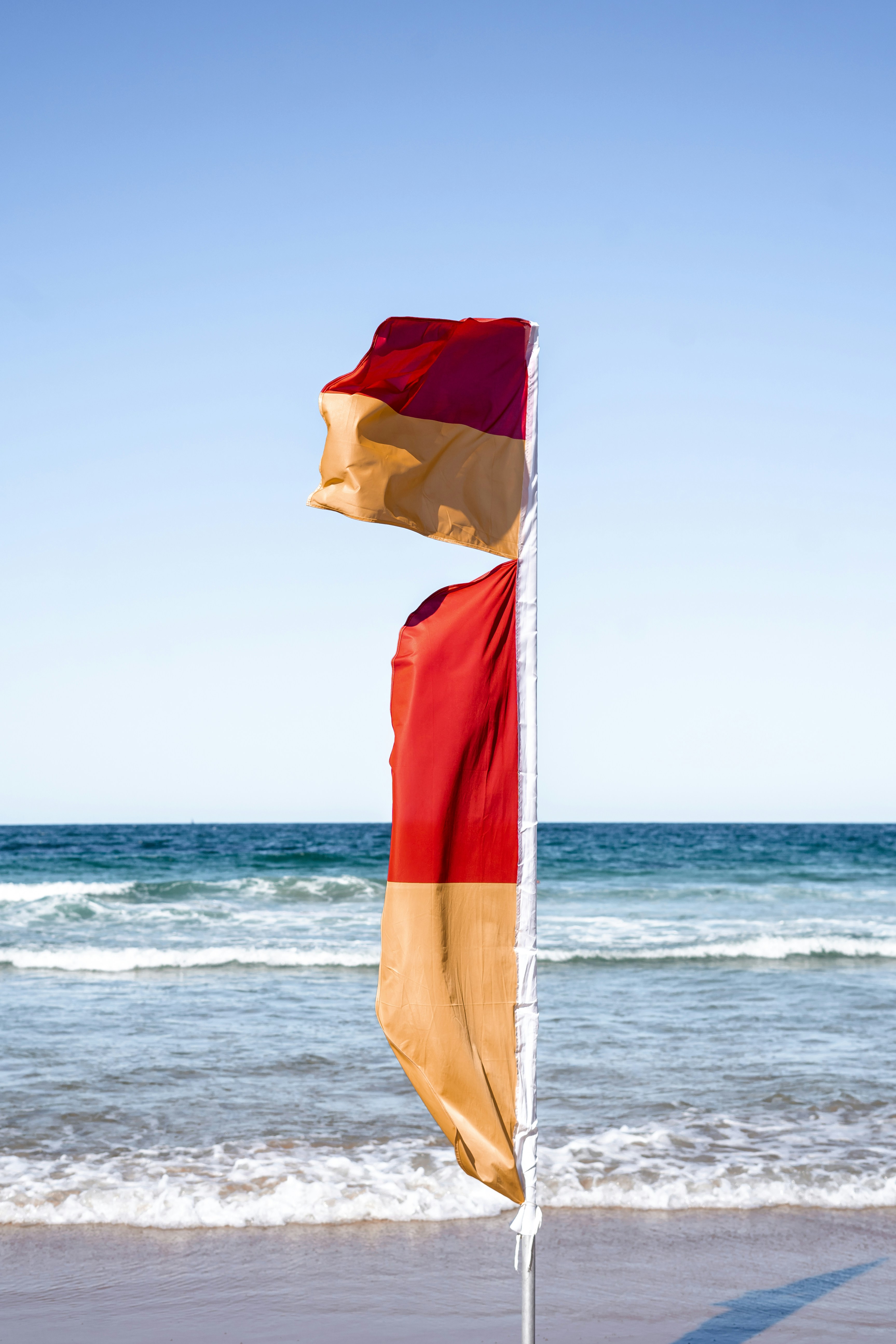 Orange and red flaglets on shore photo – Free Flag Image on Unsplash