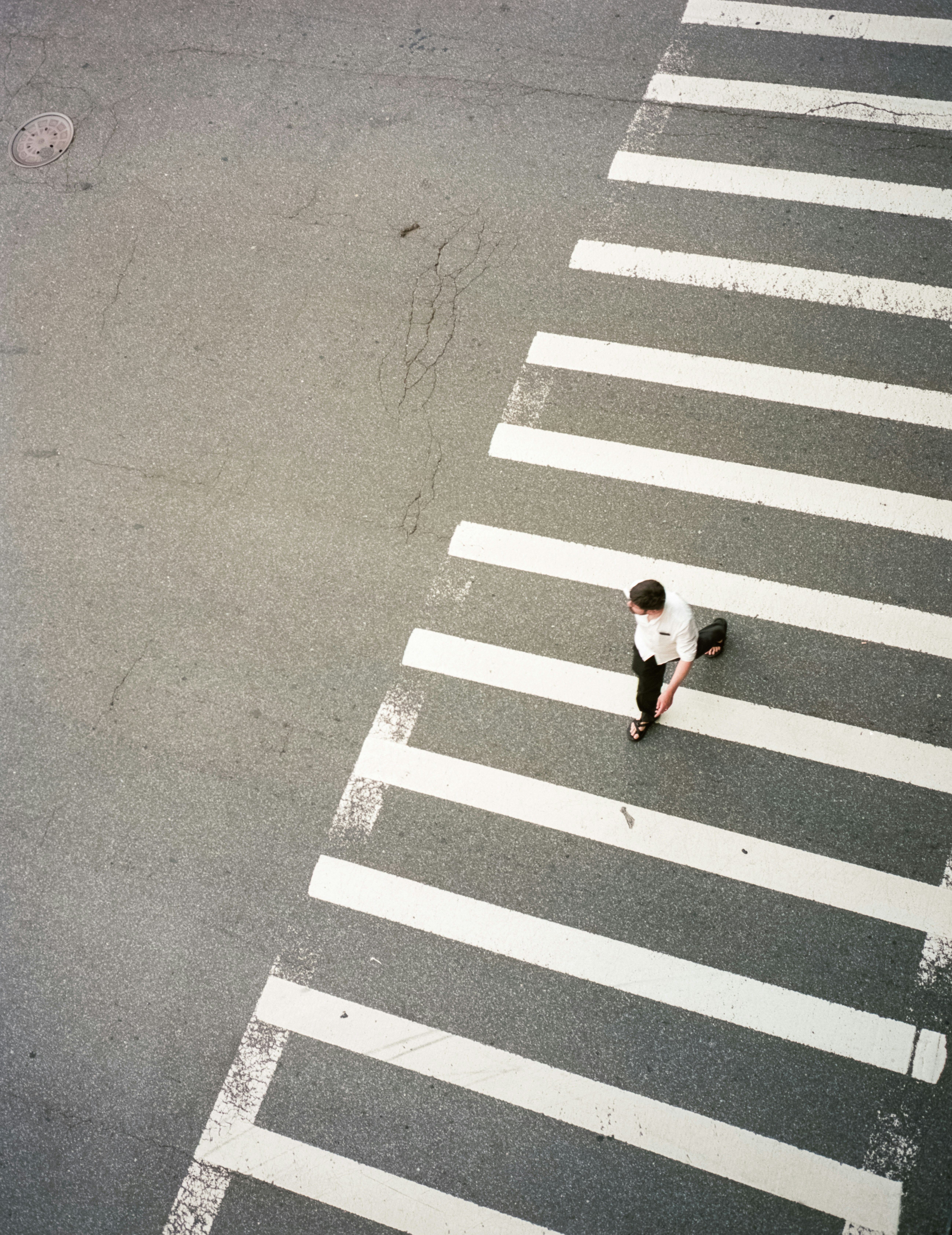 Man walking on pedestrian top view photo – Free Usa Image on Unsplash