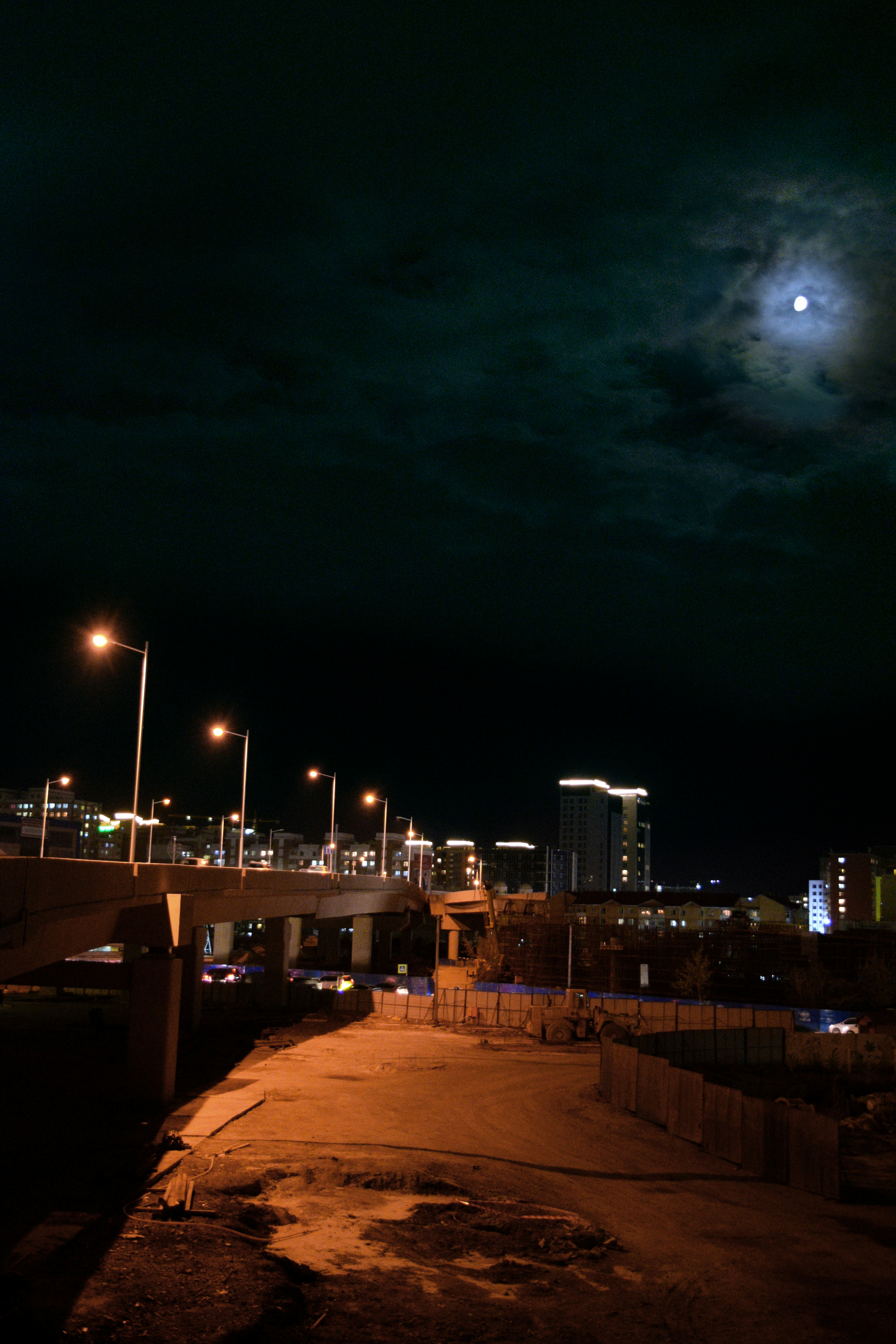 Moon over the Overpass: Nightscape of Steel, Streetlights, and Construction
