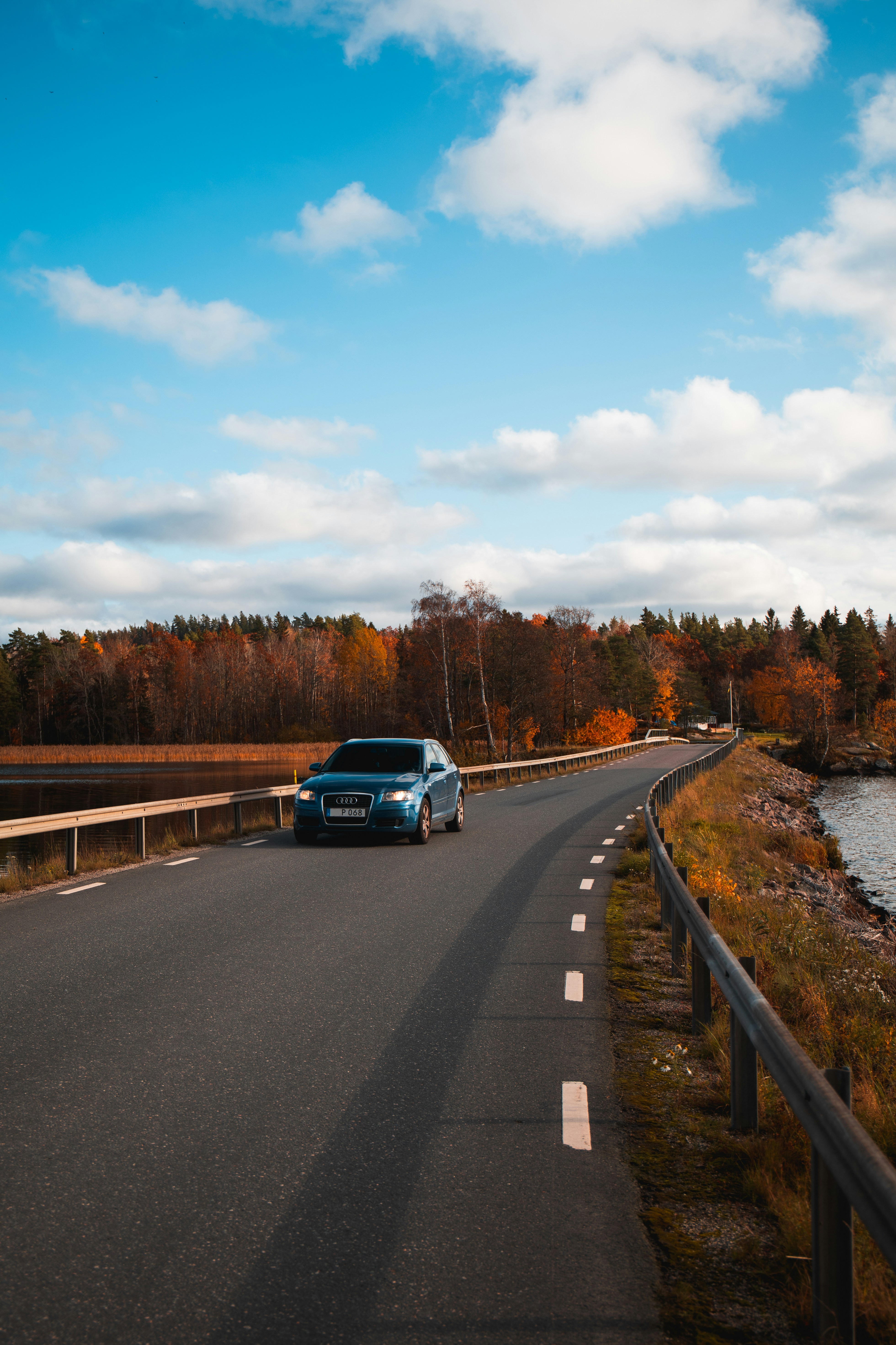 Blue vehicle on road photo – Free Blue Image on Unsplash