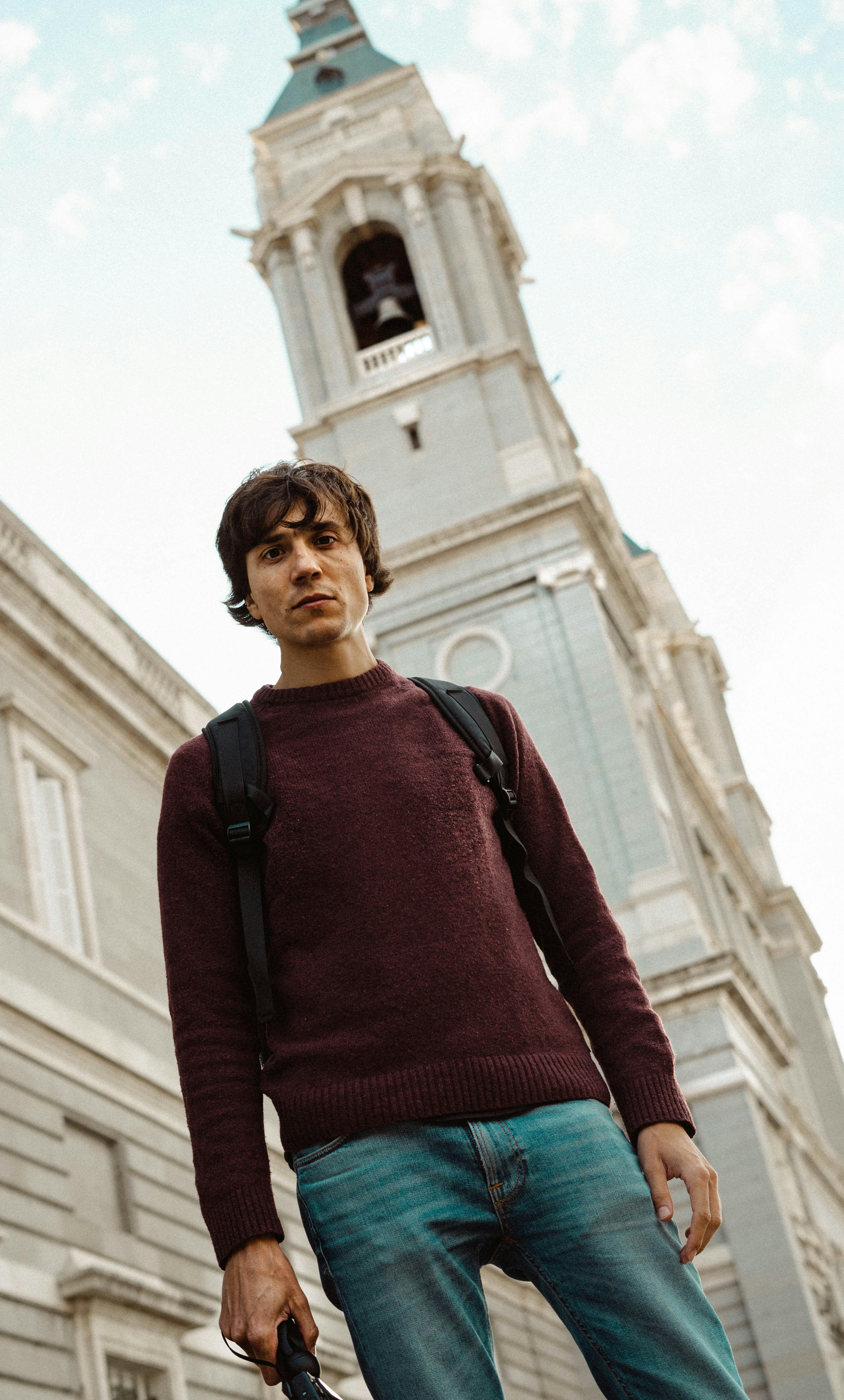 Facing the Bell Tower: A Quiet Portrait in Front of a City Cathedral