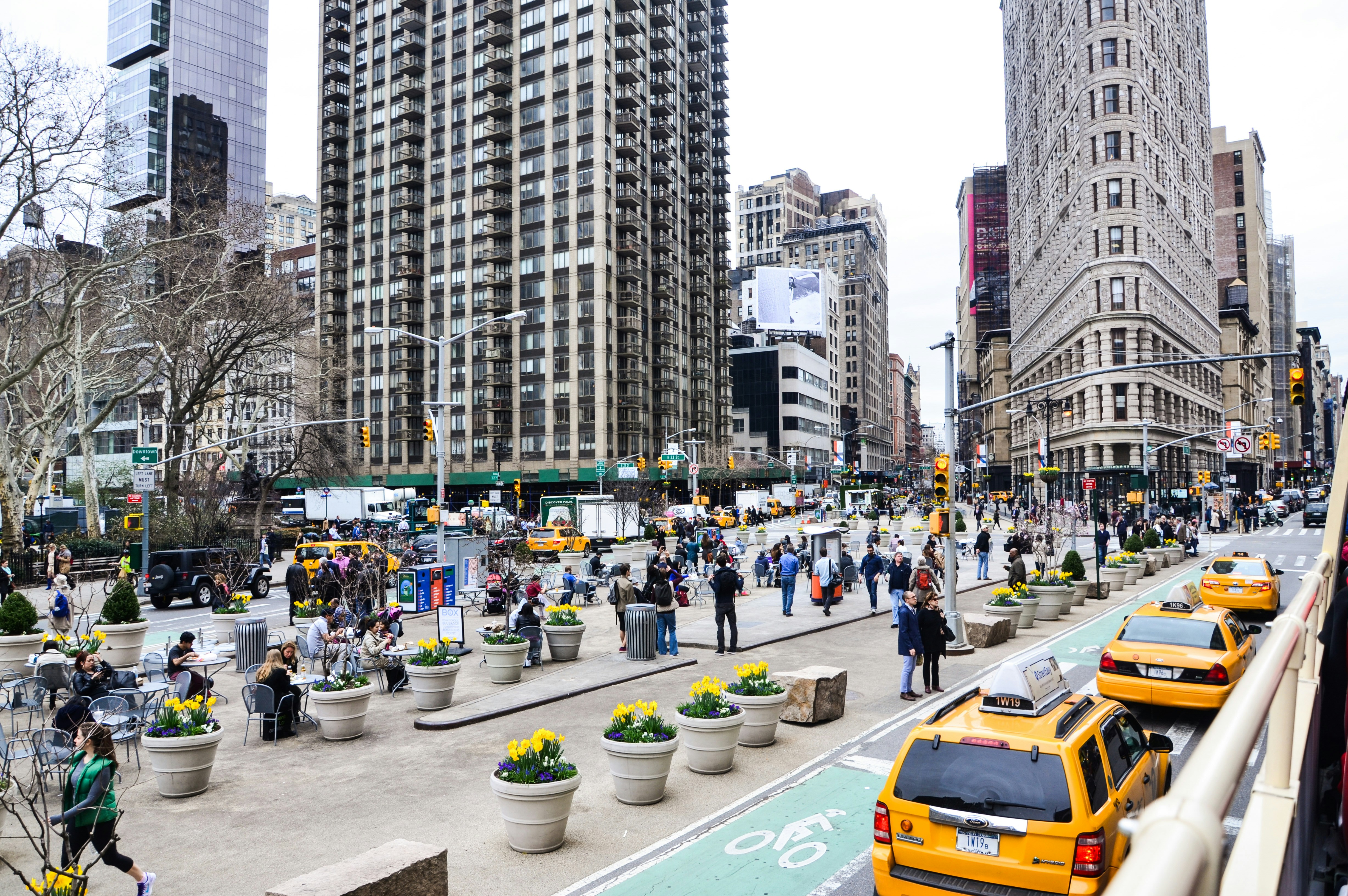City Pulse at Ground Level: Taxi Cabs and Busy Crosswalk