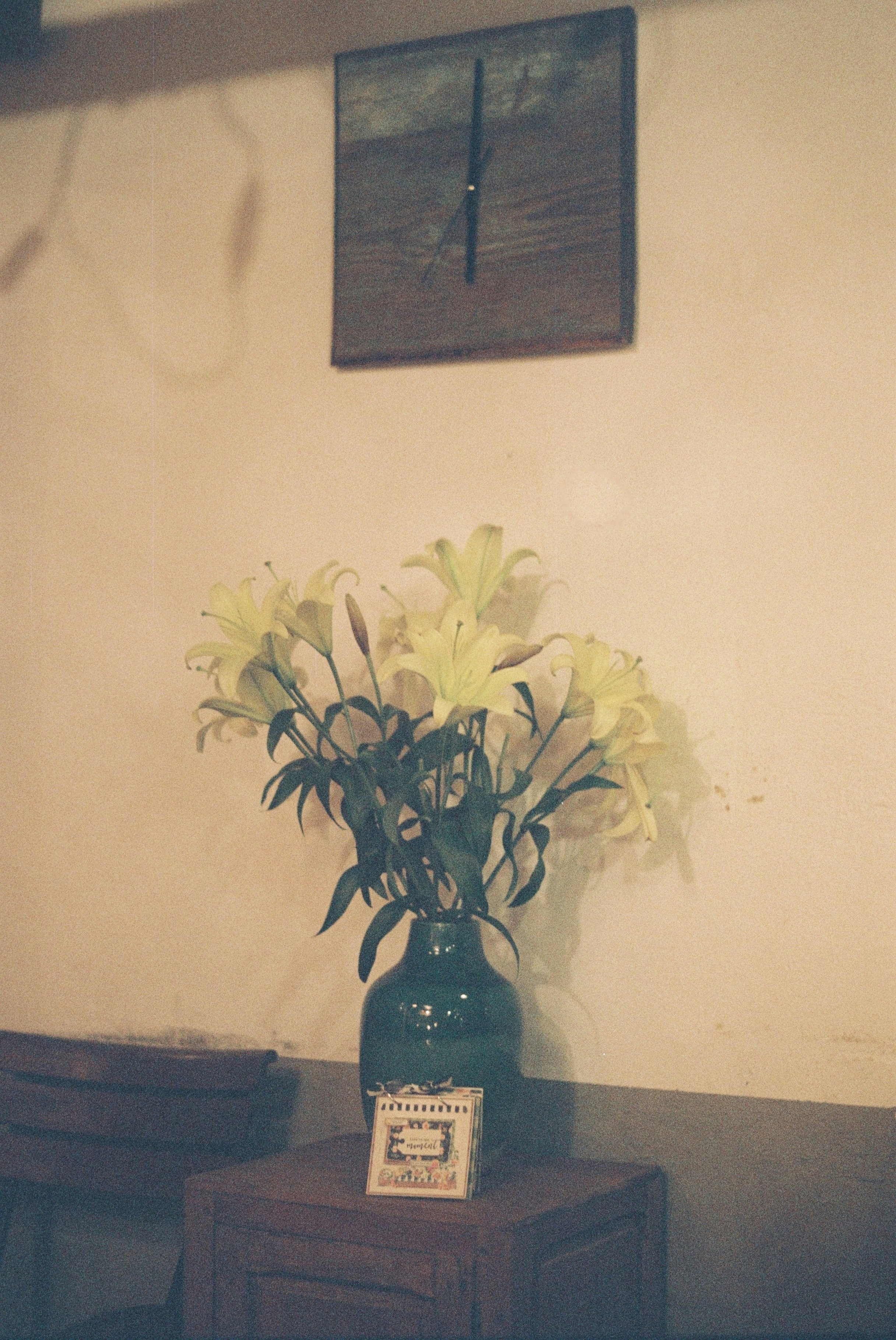 Soft Amber Bouquet under a Wall Clock