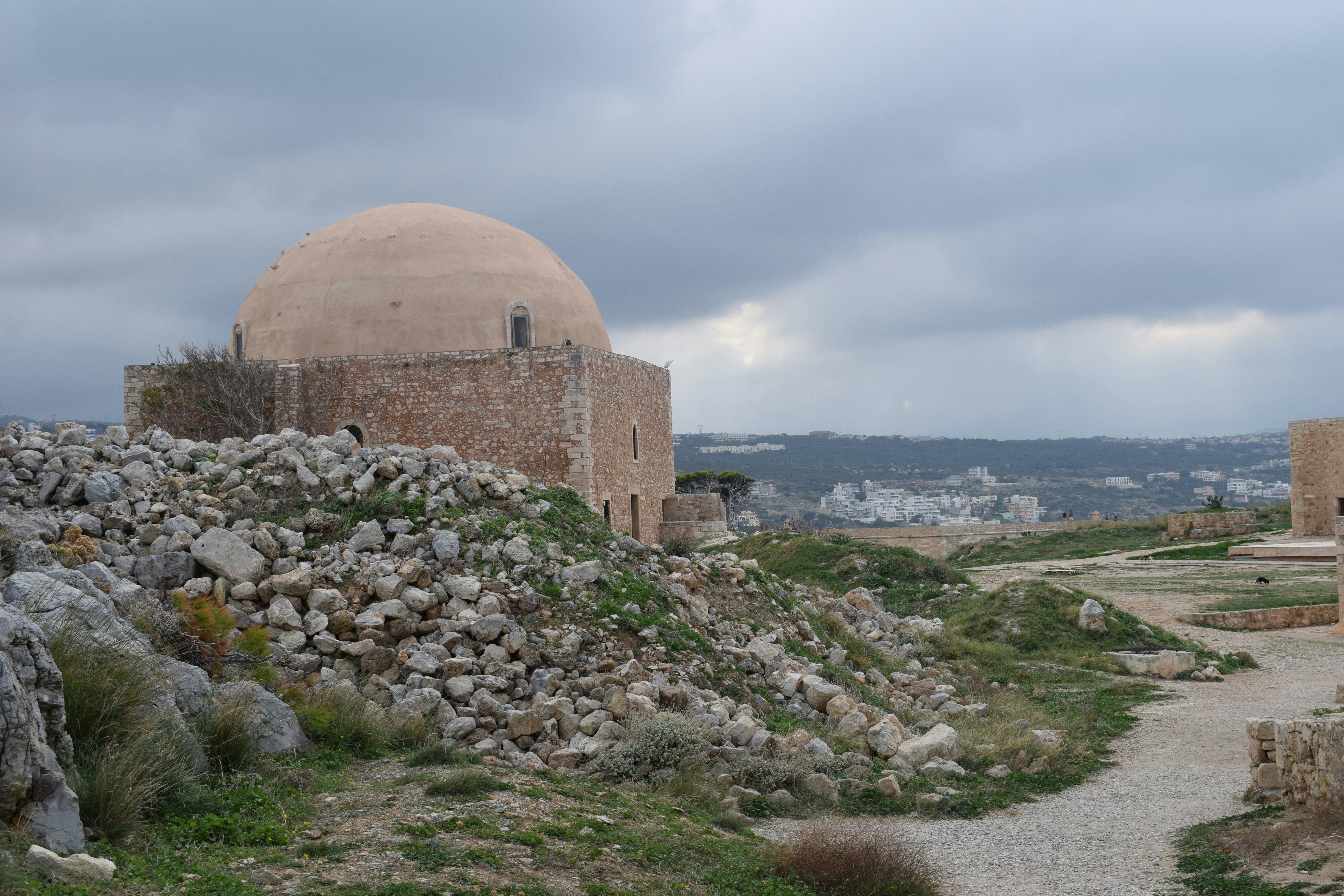 Domed Perch: A Windswept Fortress on a Rocky Promontory