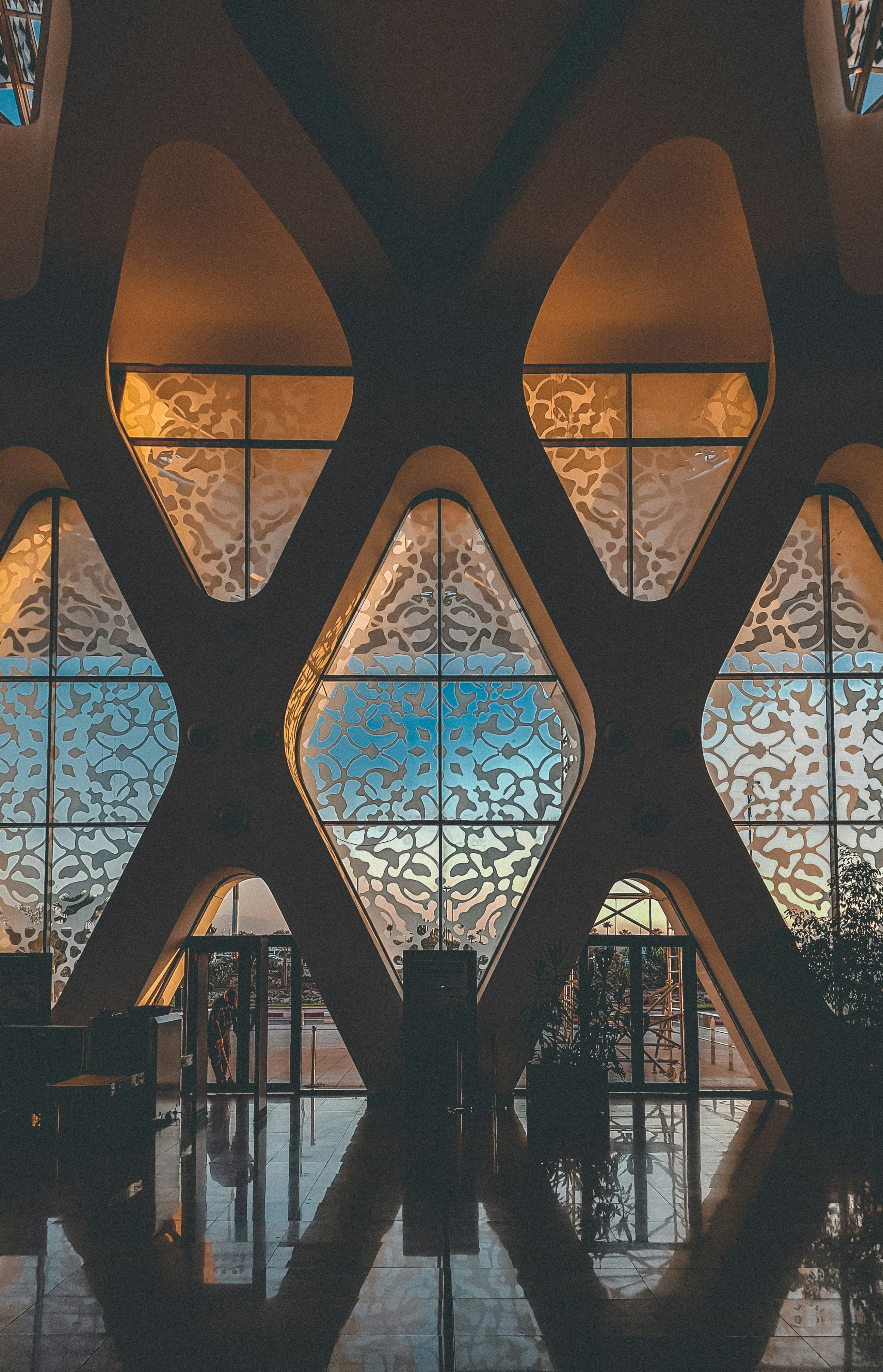 Arches of Glass: Symmetry and Light in a Lattice Atrium