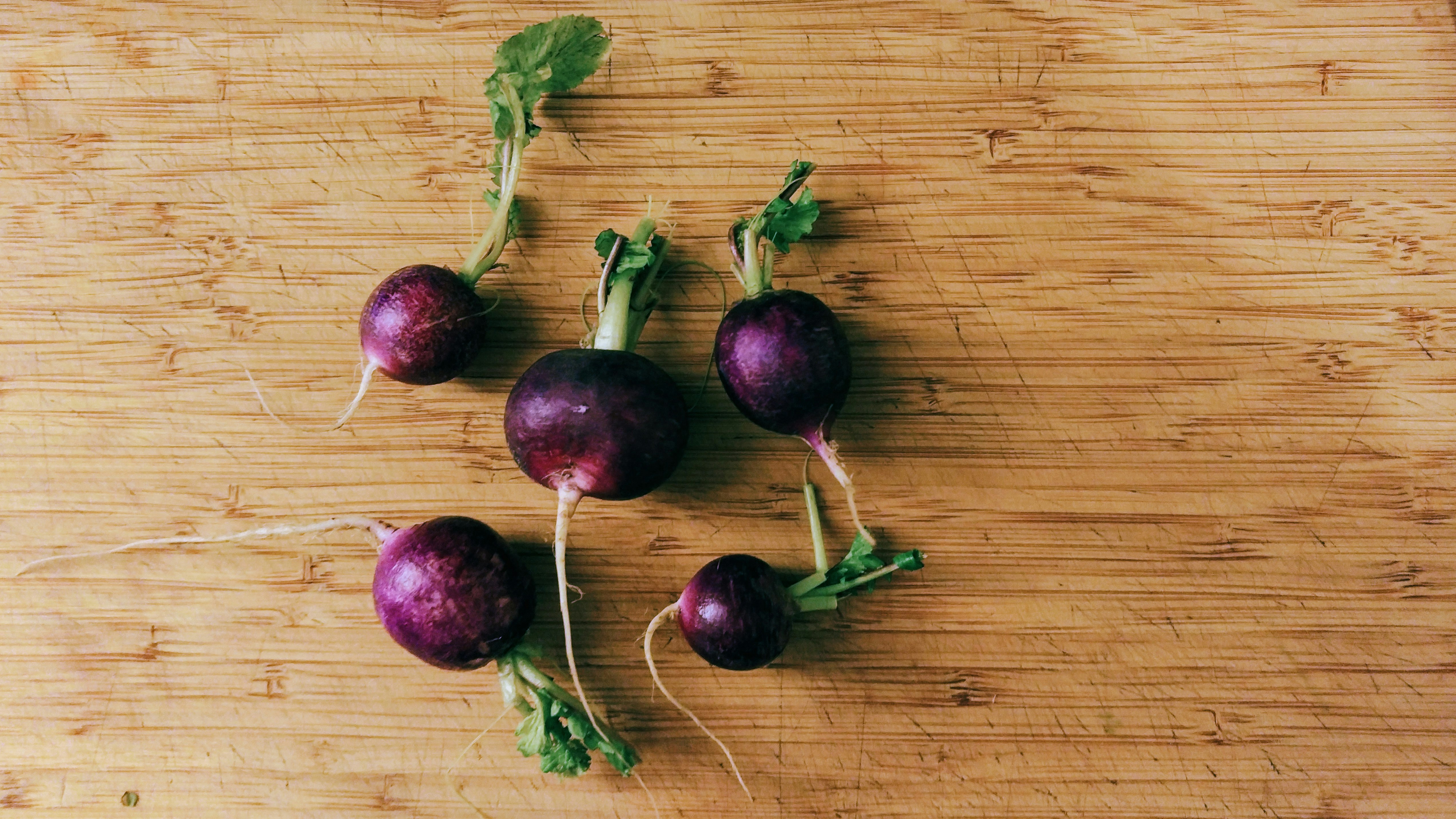 Purple radishes on a cutting board