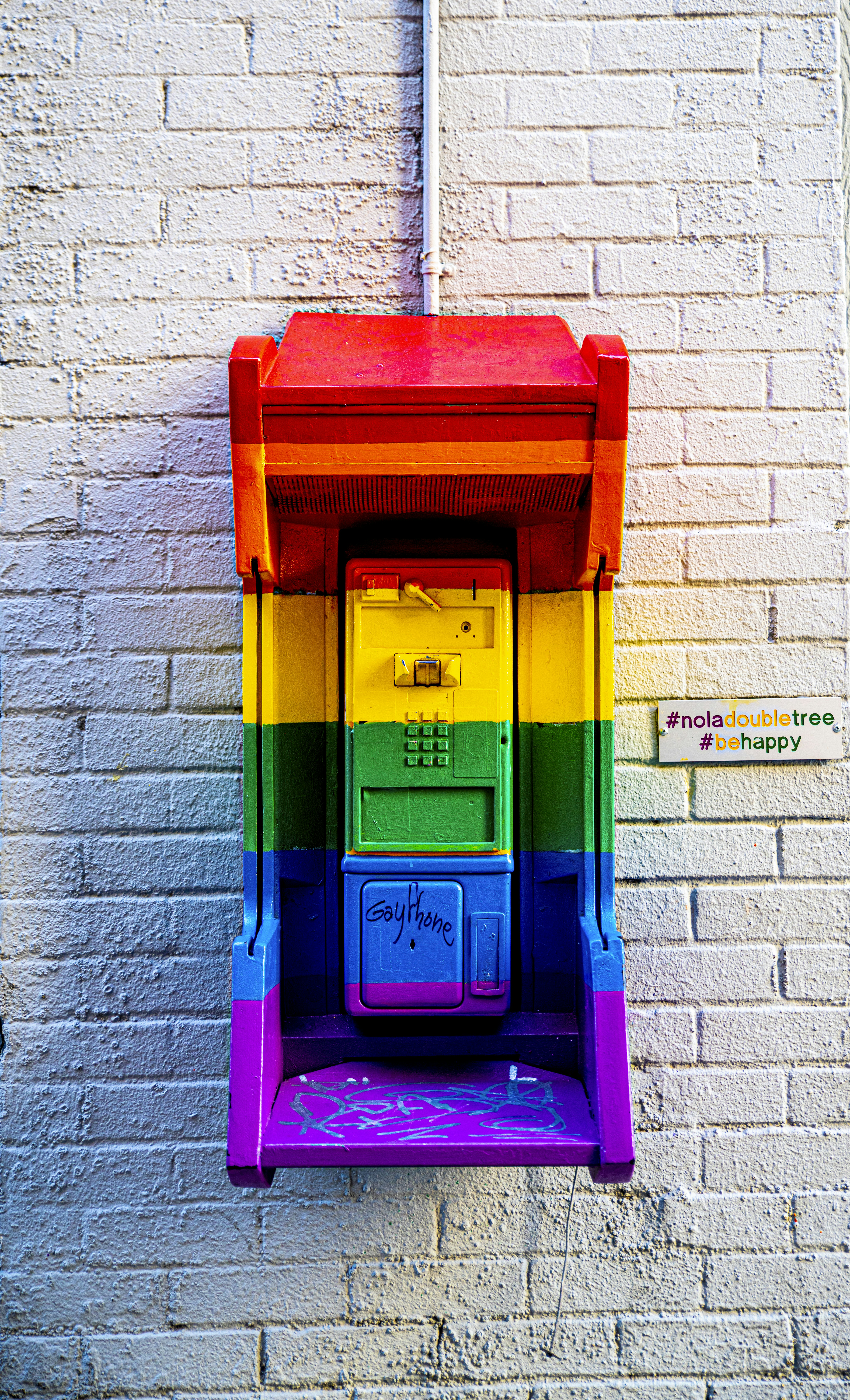A Rainbow Mailbox Anchored to the Wall