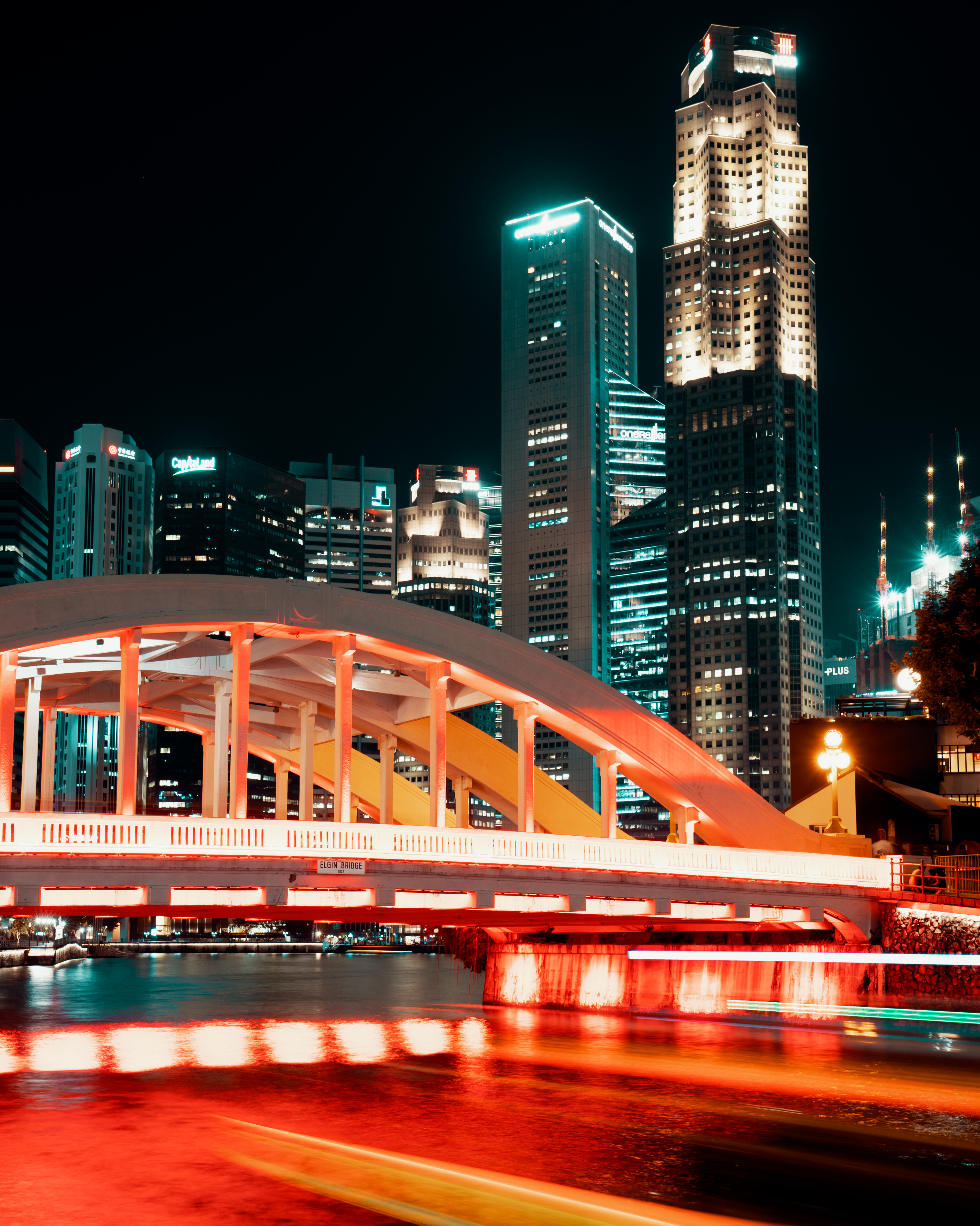 Photography of lighted arc bridge near buildings photo – Free Building ...