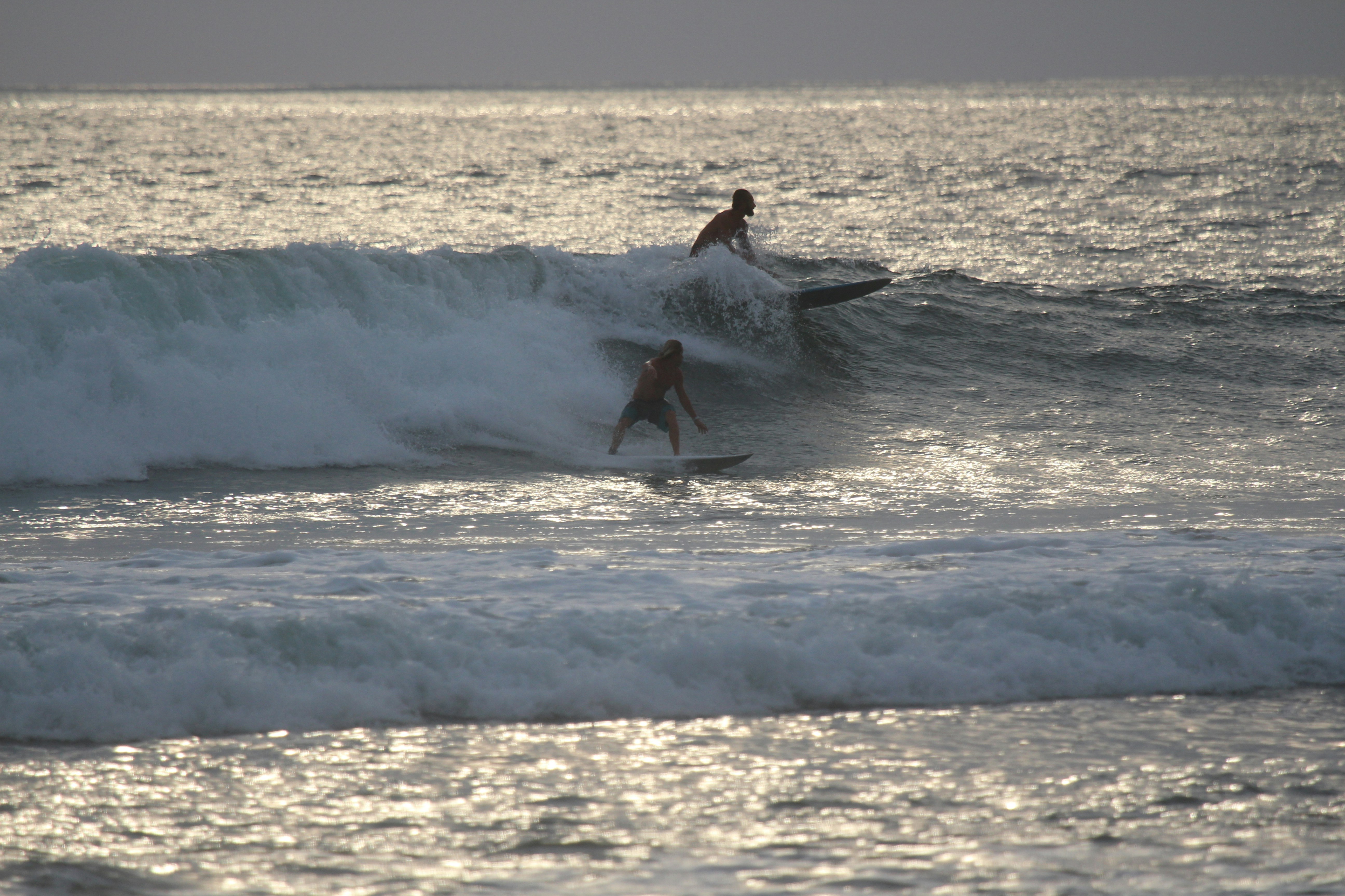 Two person surfing during daytime photo – Free Grey Image on Unsplash