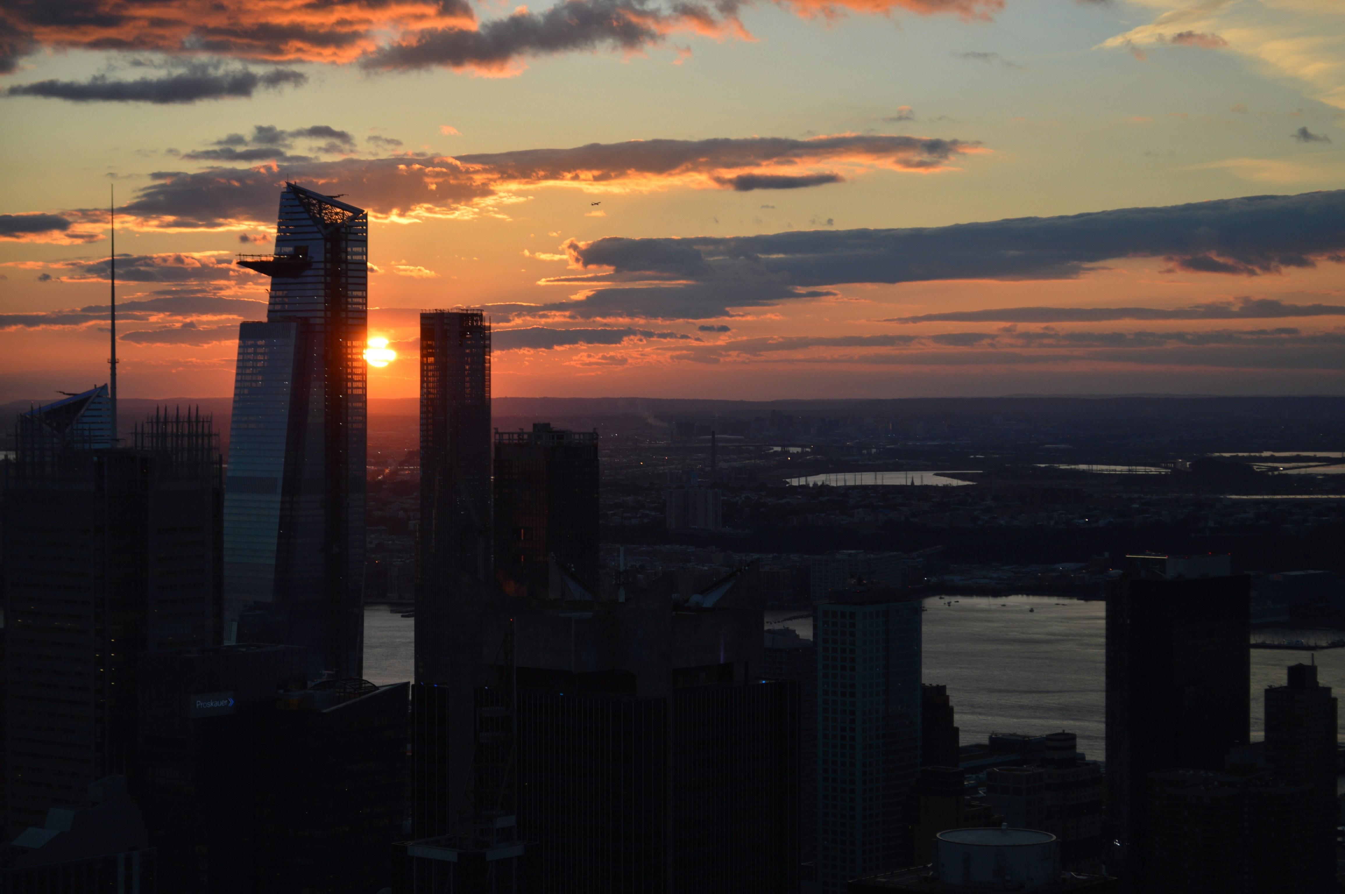 Dusk Over Glass and Shadow: Sunset Anchors the City Spine