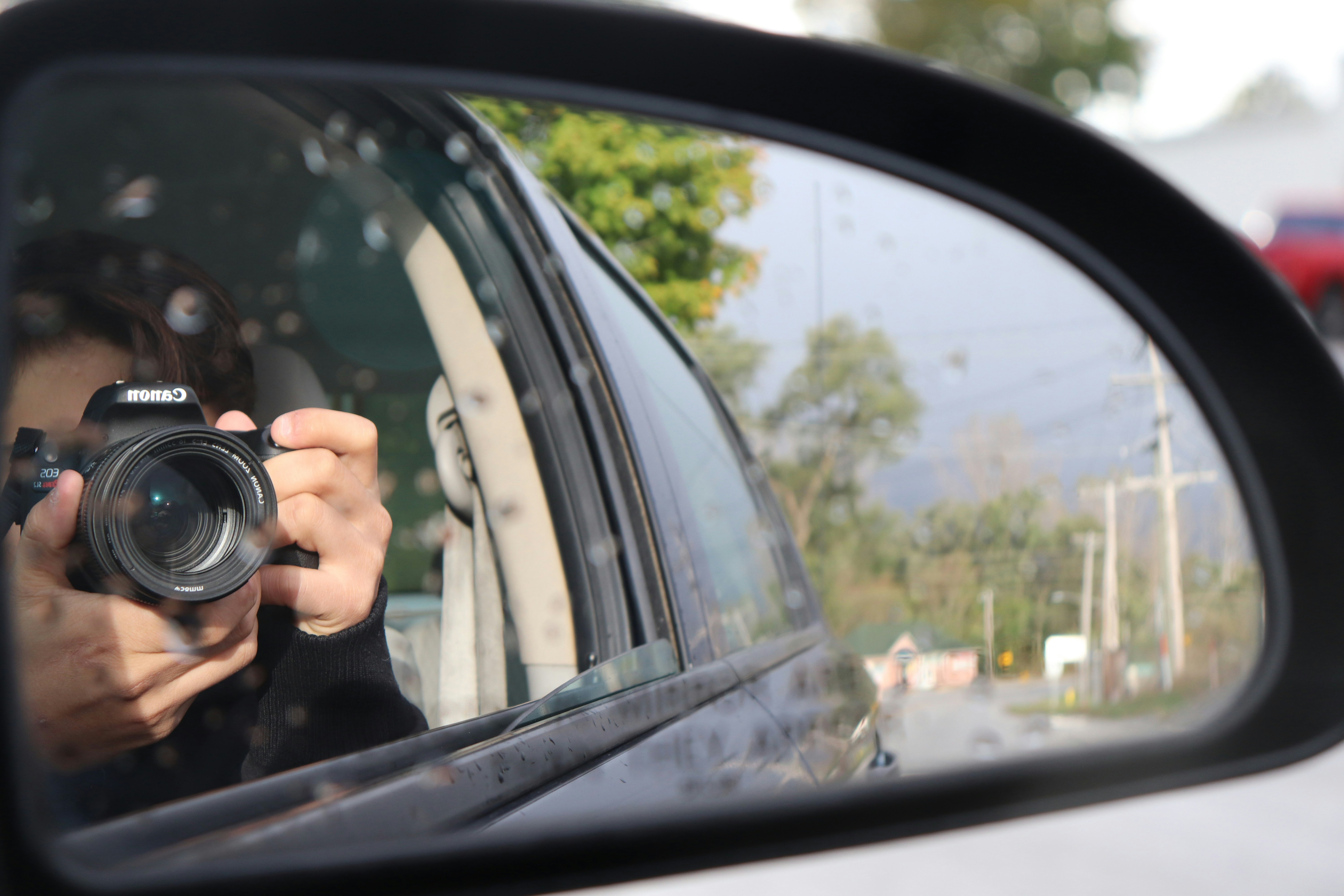 Reflection of person aiming DSLR camera photo – Free Vehicle Image on ...