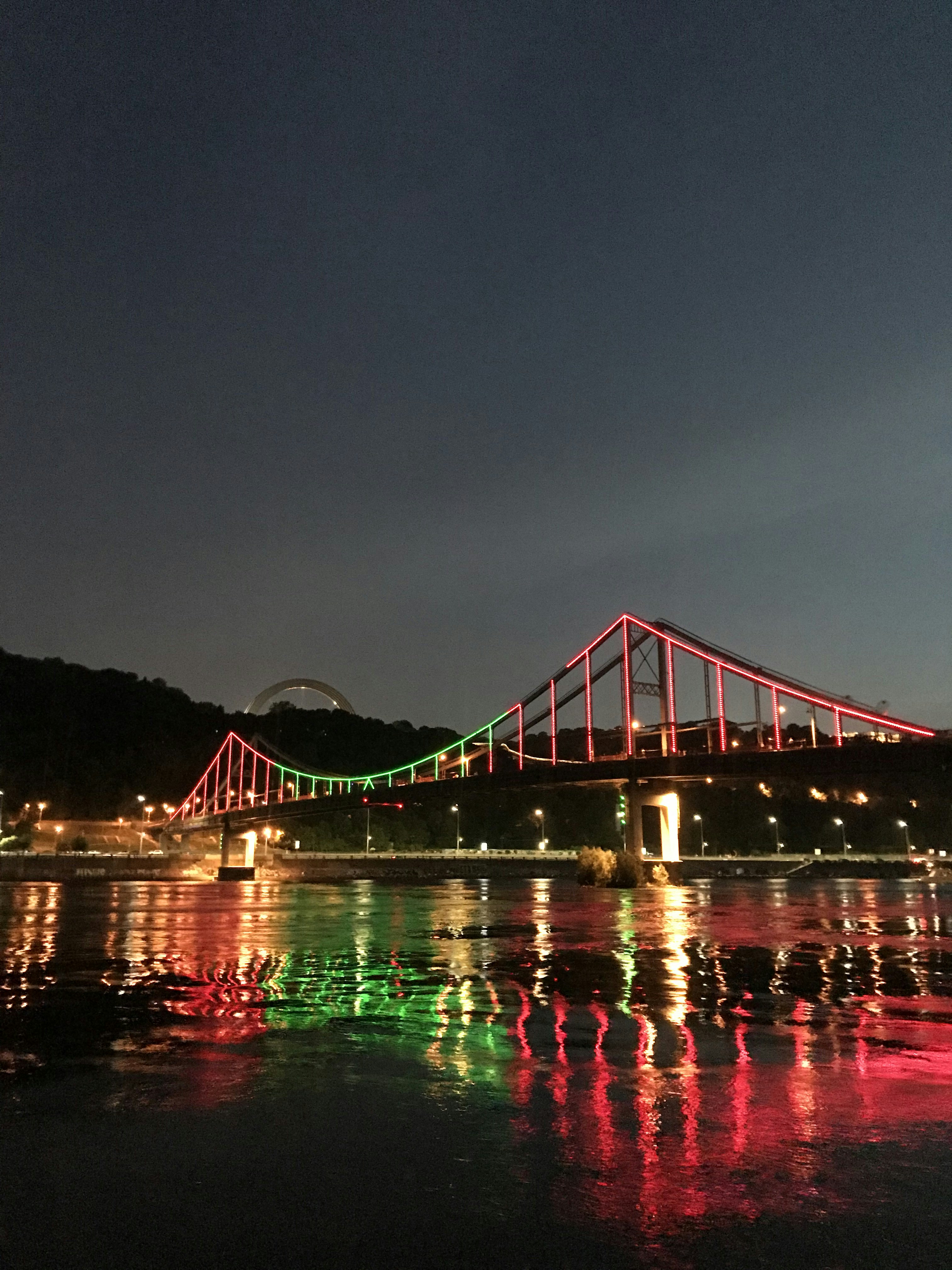 iron bridge with green and red lights during nighttime