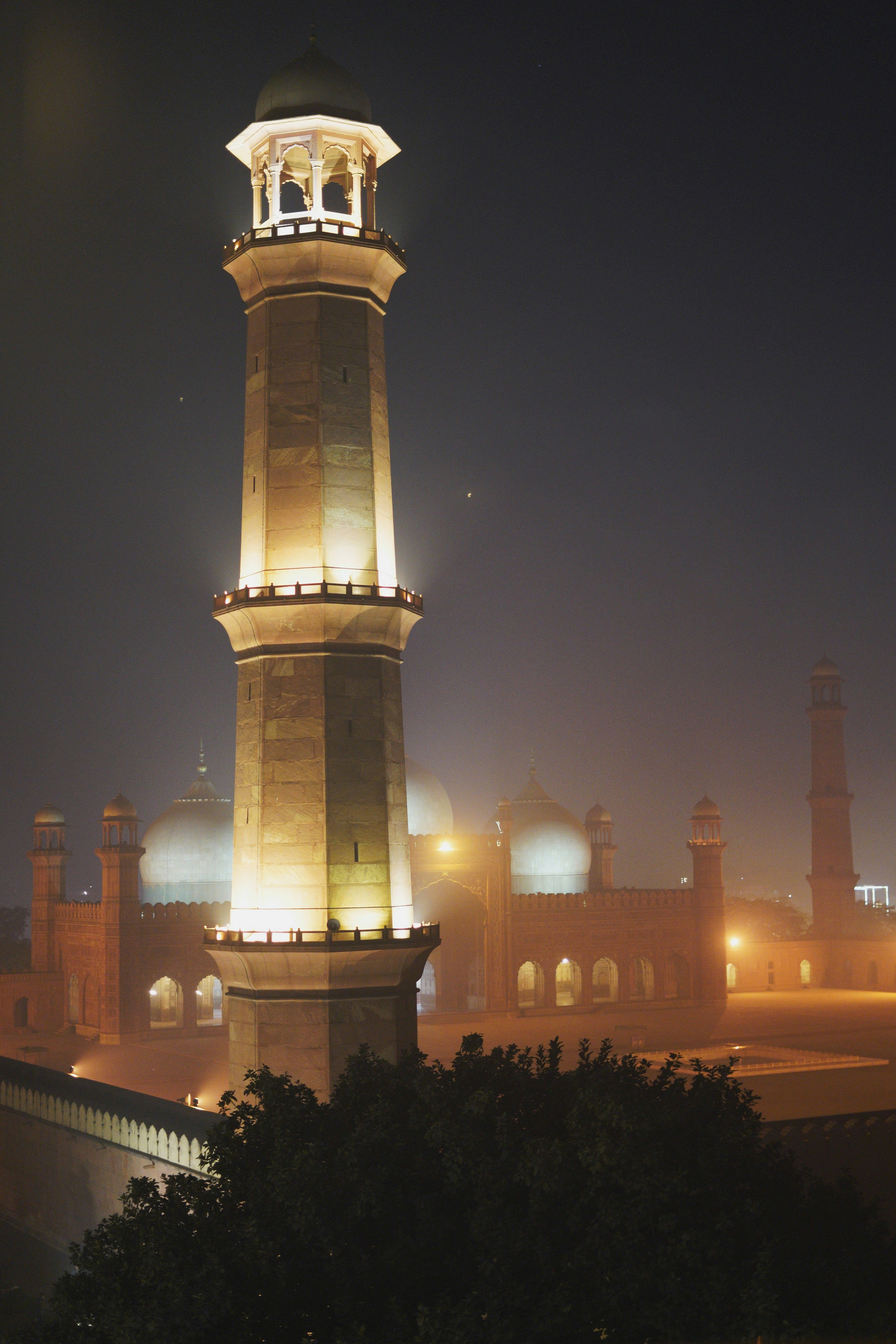 Moonlit Minaret Piercing the Mist Over a Quiet Mosque