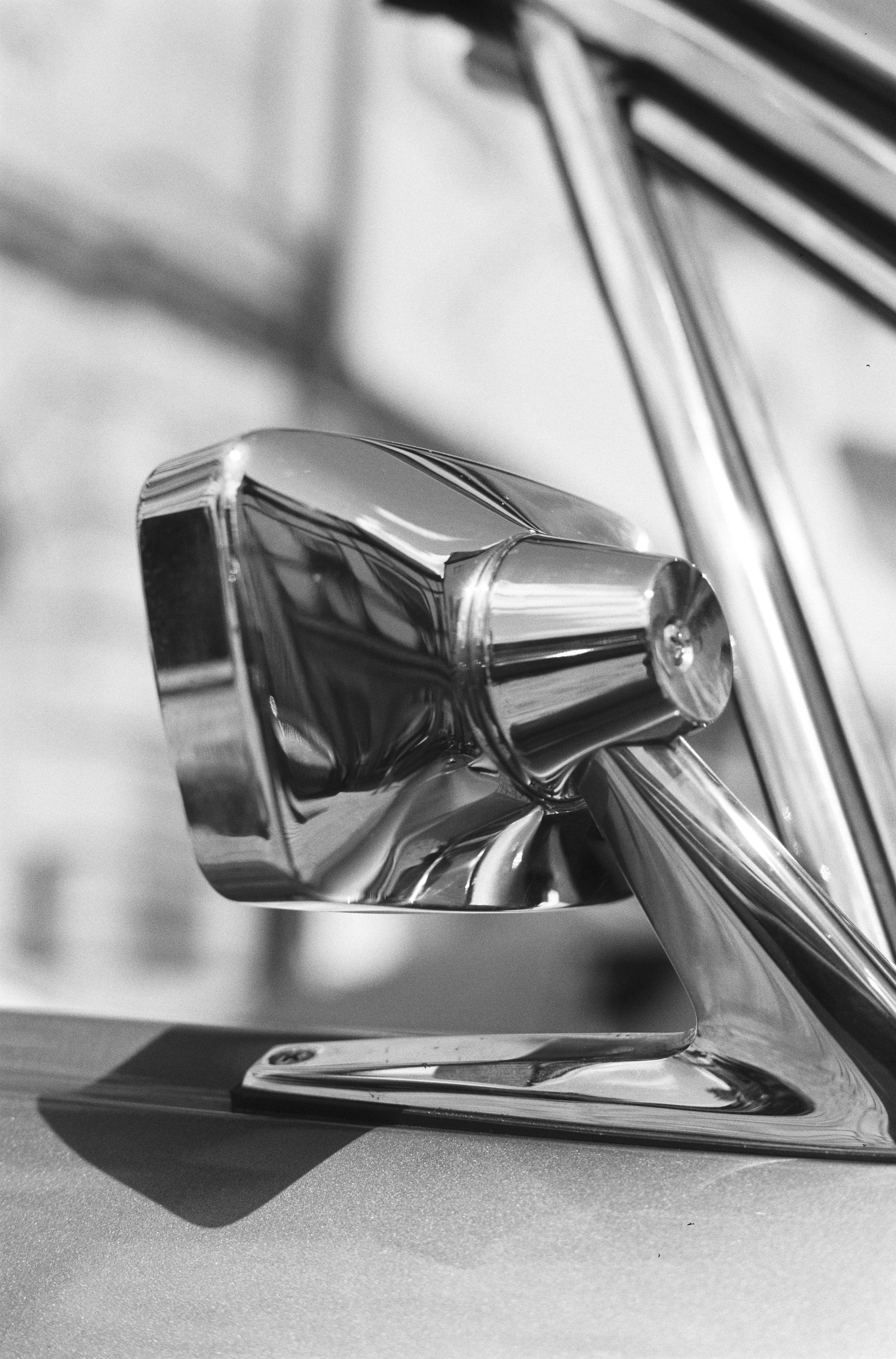 Vintage oldtimer chromed side mirror. Made with Leica R7 (Year: 1994) and Leica Summicron-R 2.0 90mm (Year: 1981). Analog scan via meinfilmlab.de: Fuji Frontier SP-3000. Film reel: Ilford FP4 Plus 125