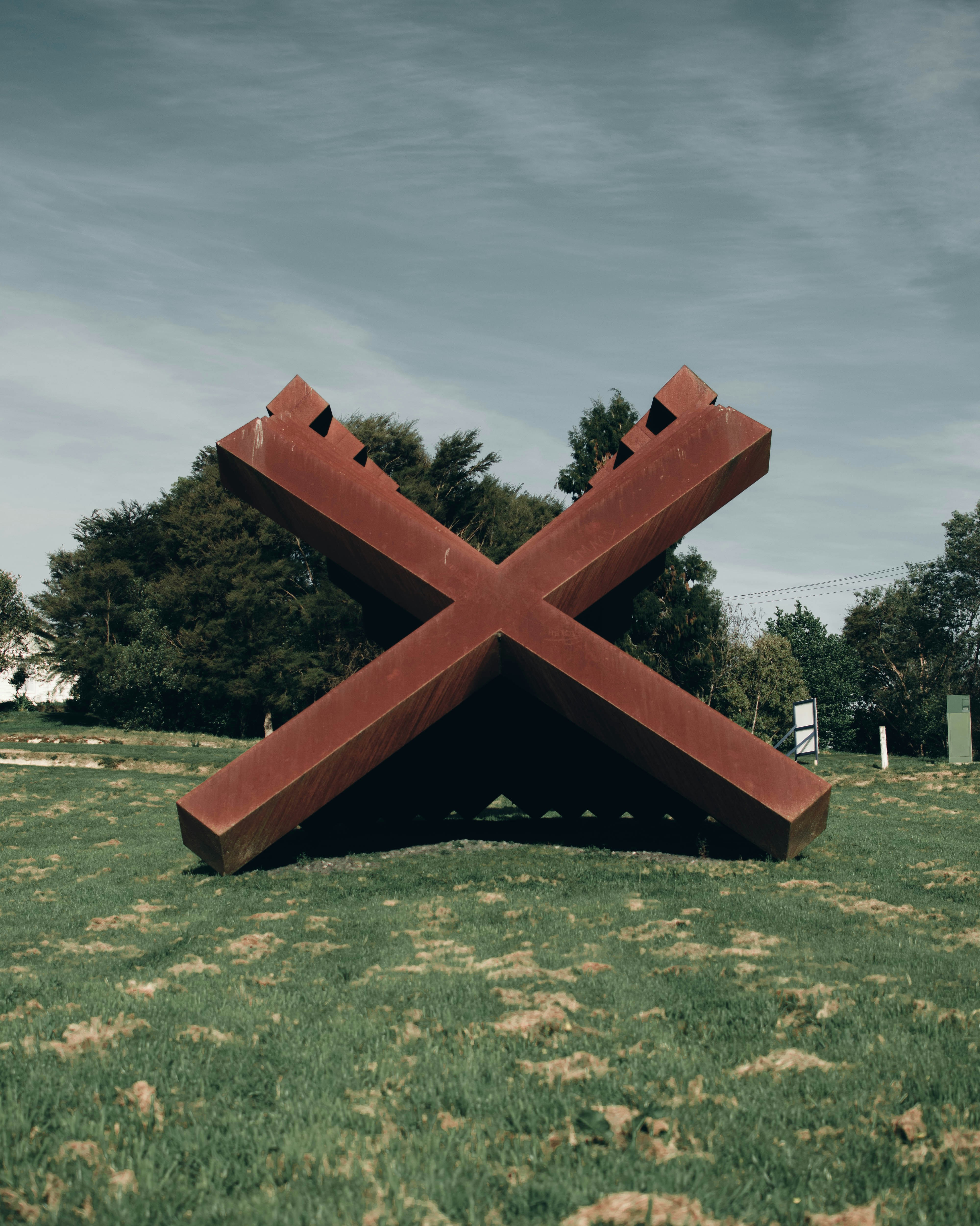 Giant red cross wooden signage on green grass photo – Free Brown Image ...