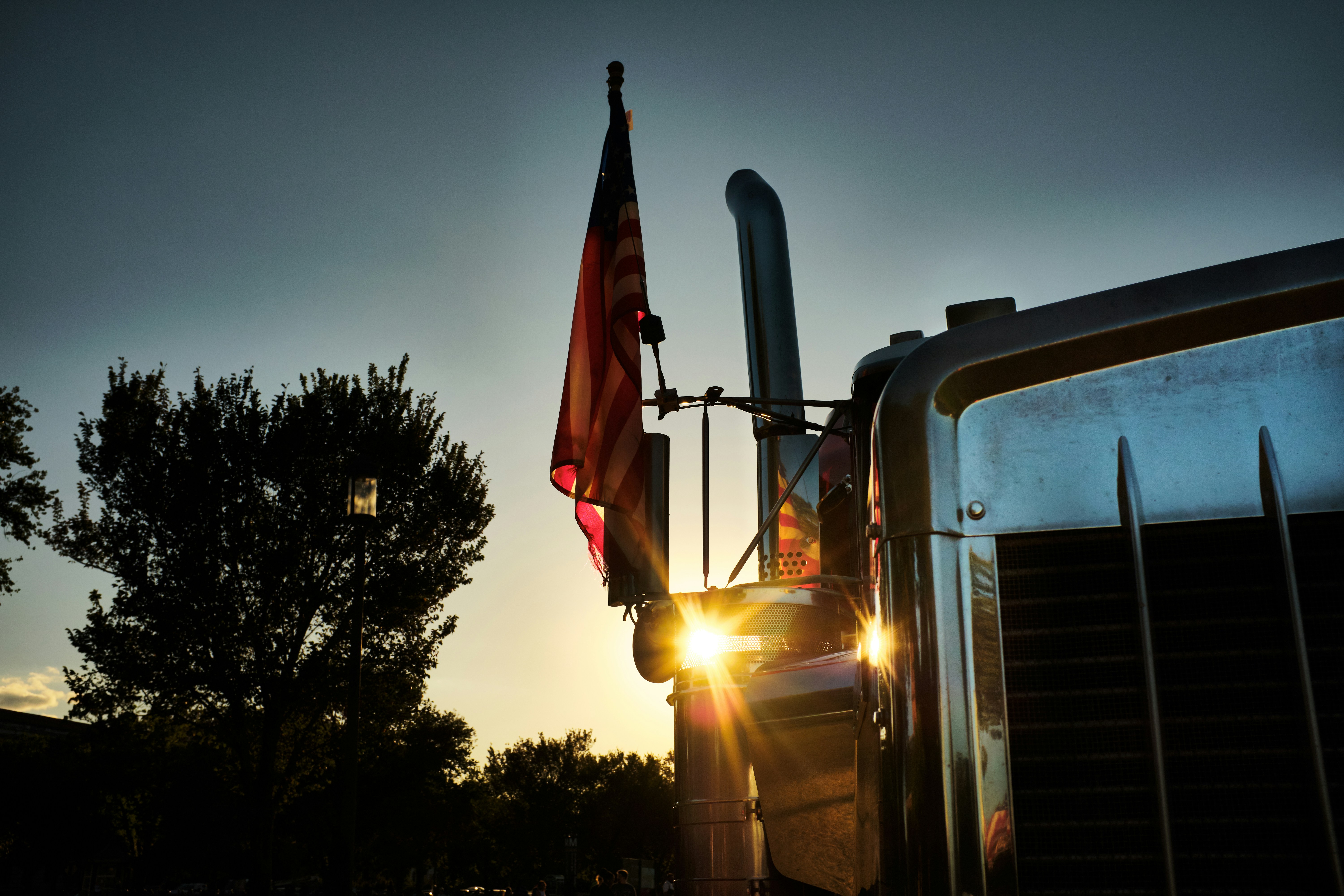 Flaglet hanging on a pole of a truck photo – Free Light Image on Unsplash