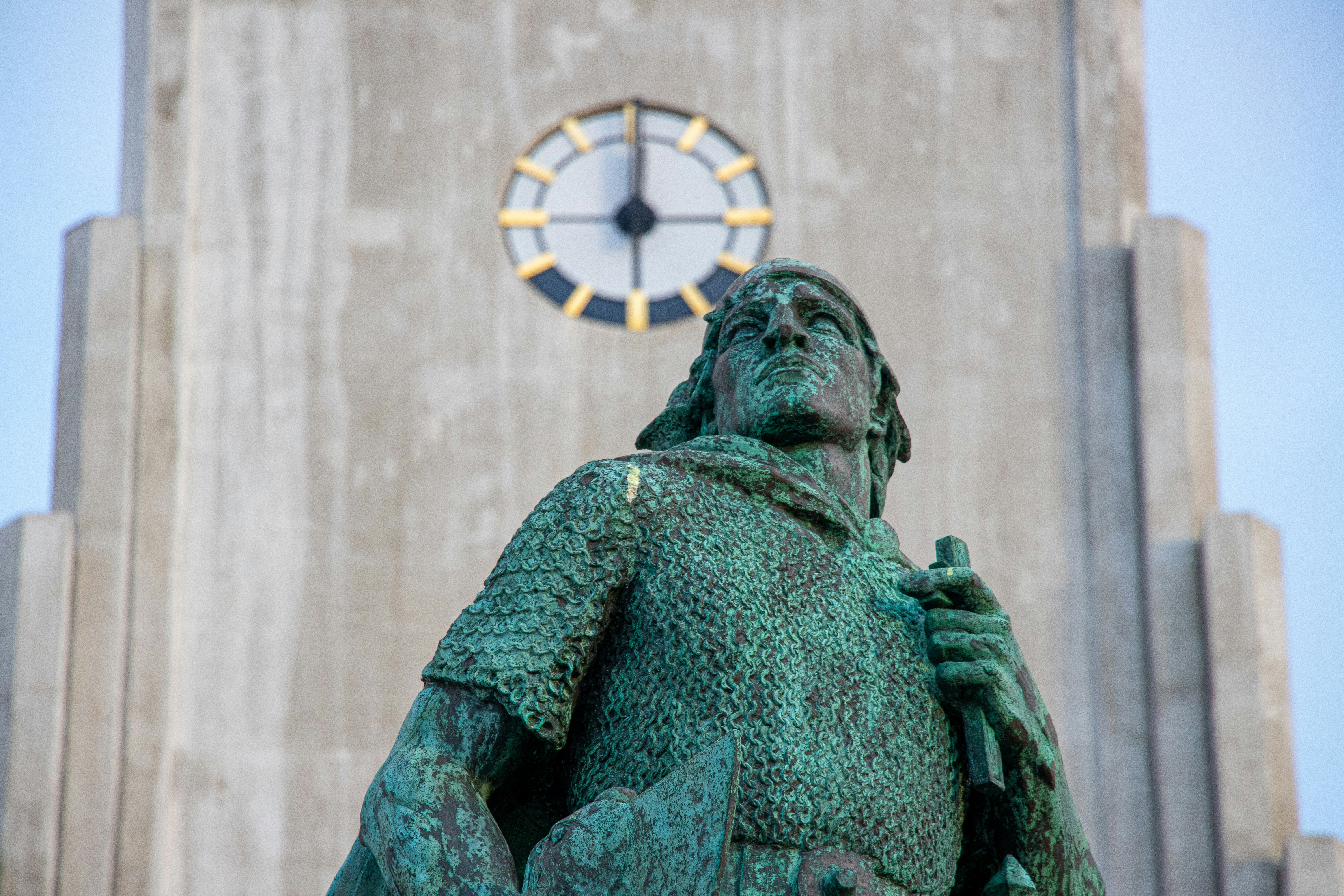 Verdigris Warrior Framed by the Clock Tower
