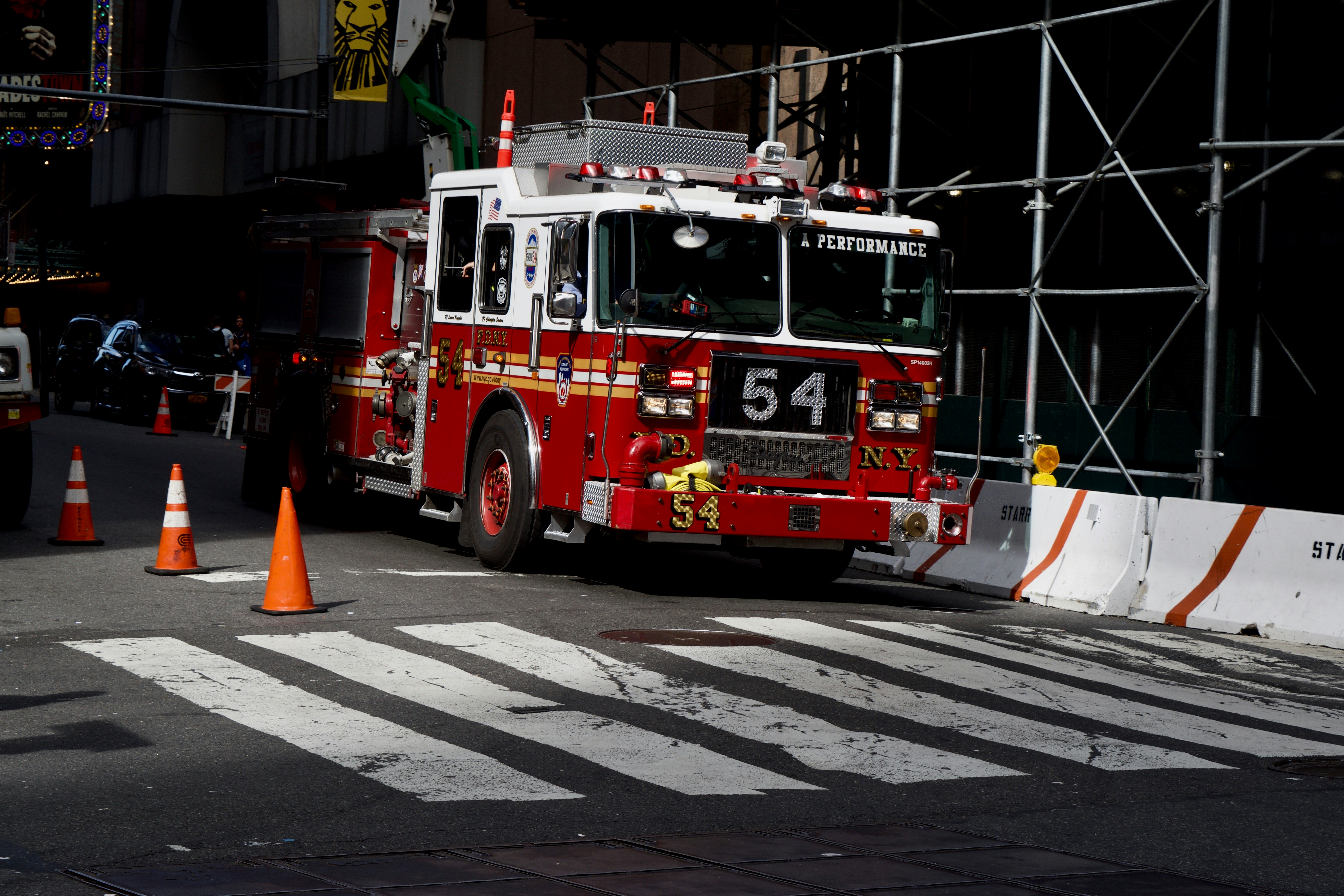 Urban Crosswalk Rescue: Fire Engine at a Neon Night Street