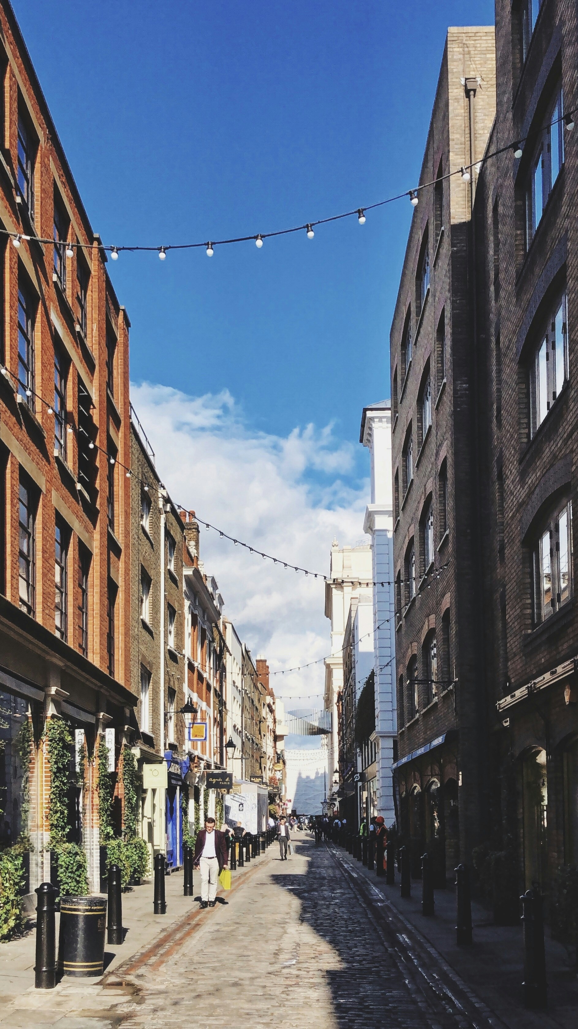Pathway surrounded by building photo – Free Blue Image on Unsplash