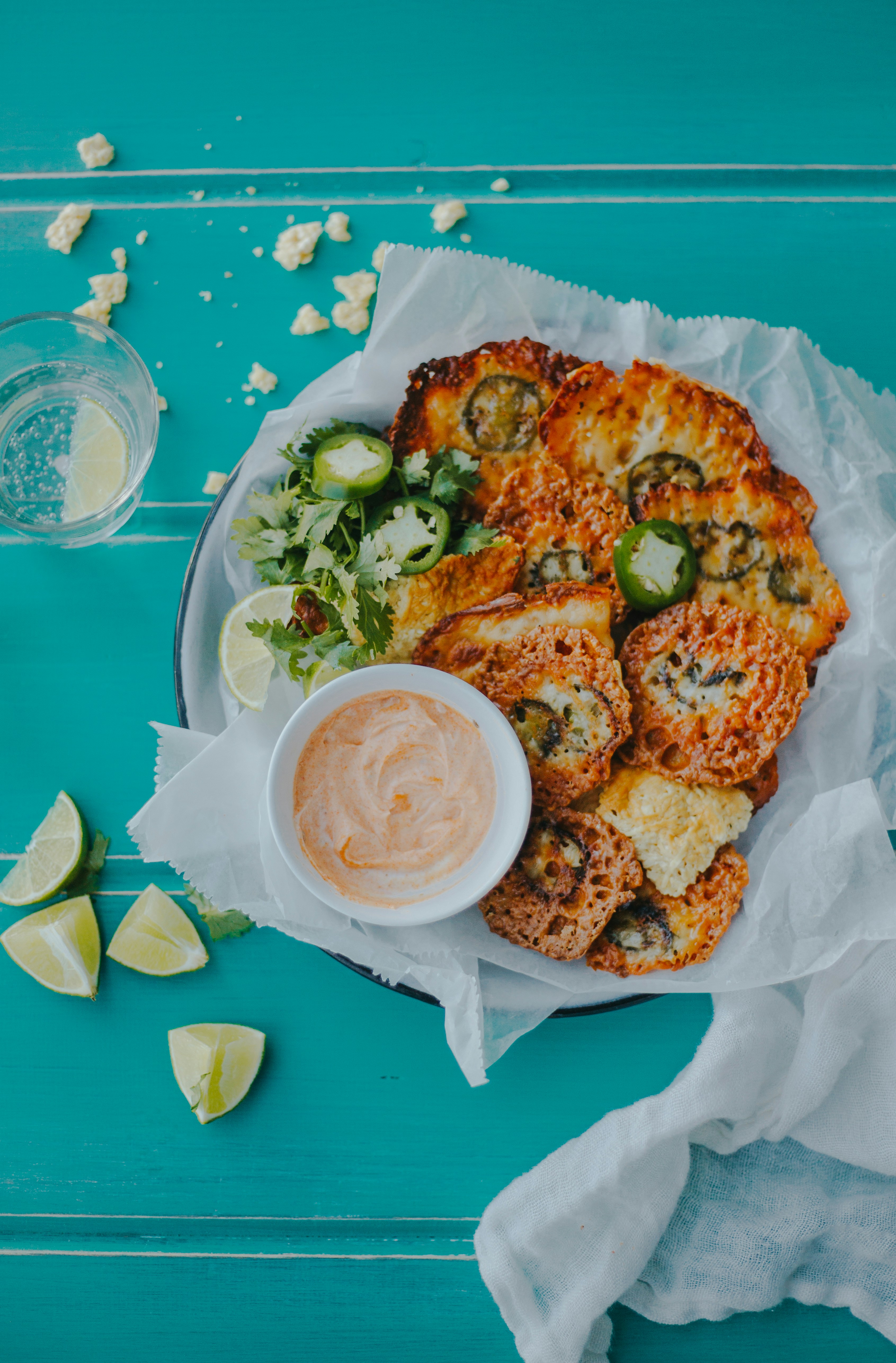 Crisp Golden Bites: Fritters and Citrus Dip on a Turquoise Table
