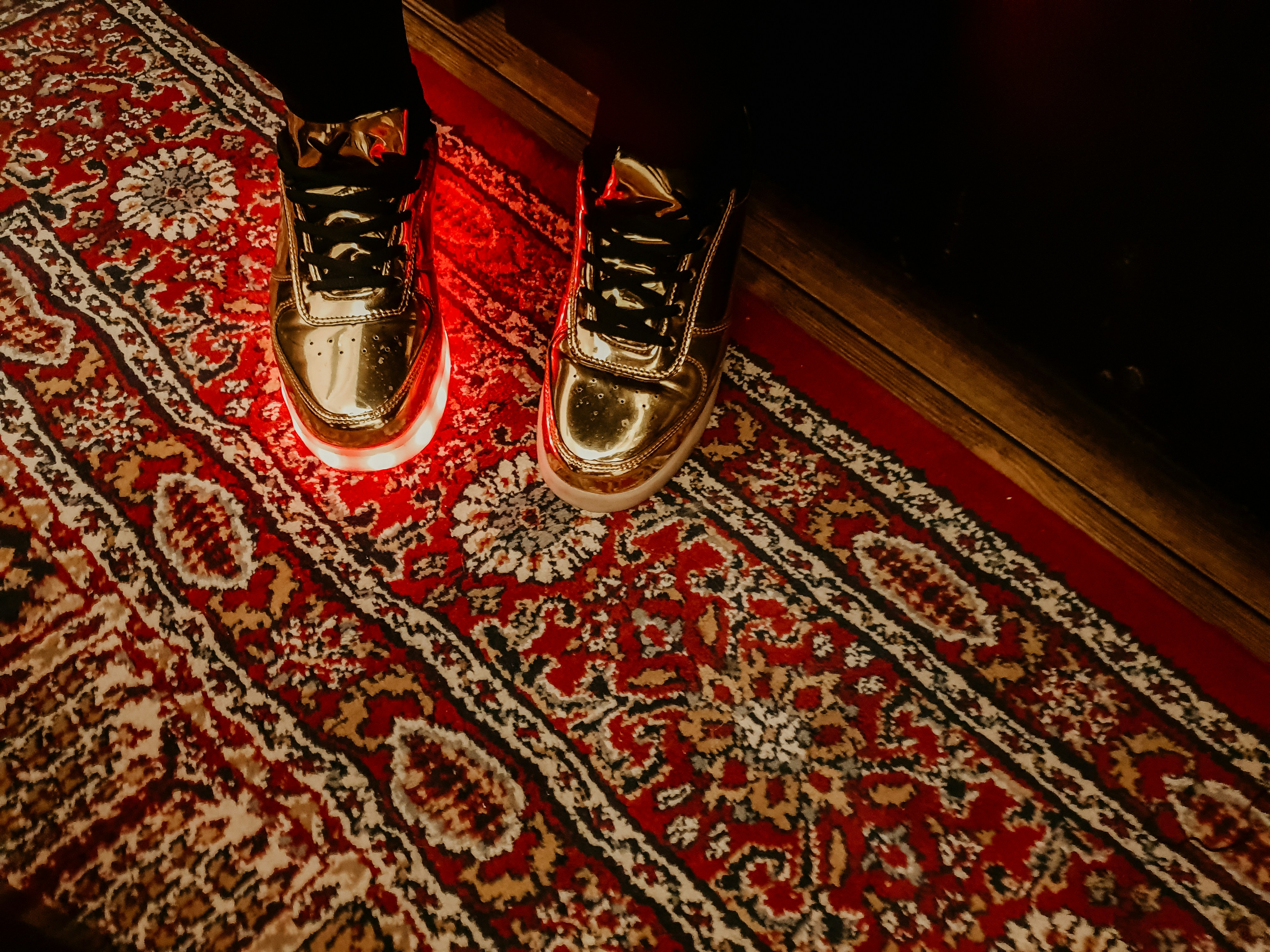 Luminous Sneakers Grounded on a Persian-Pattern Rug