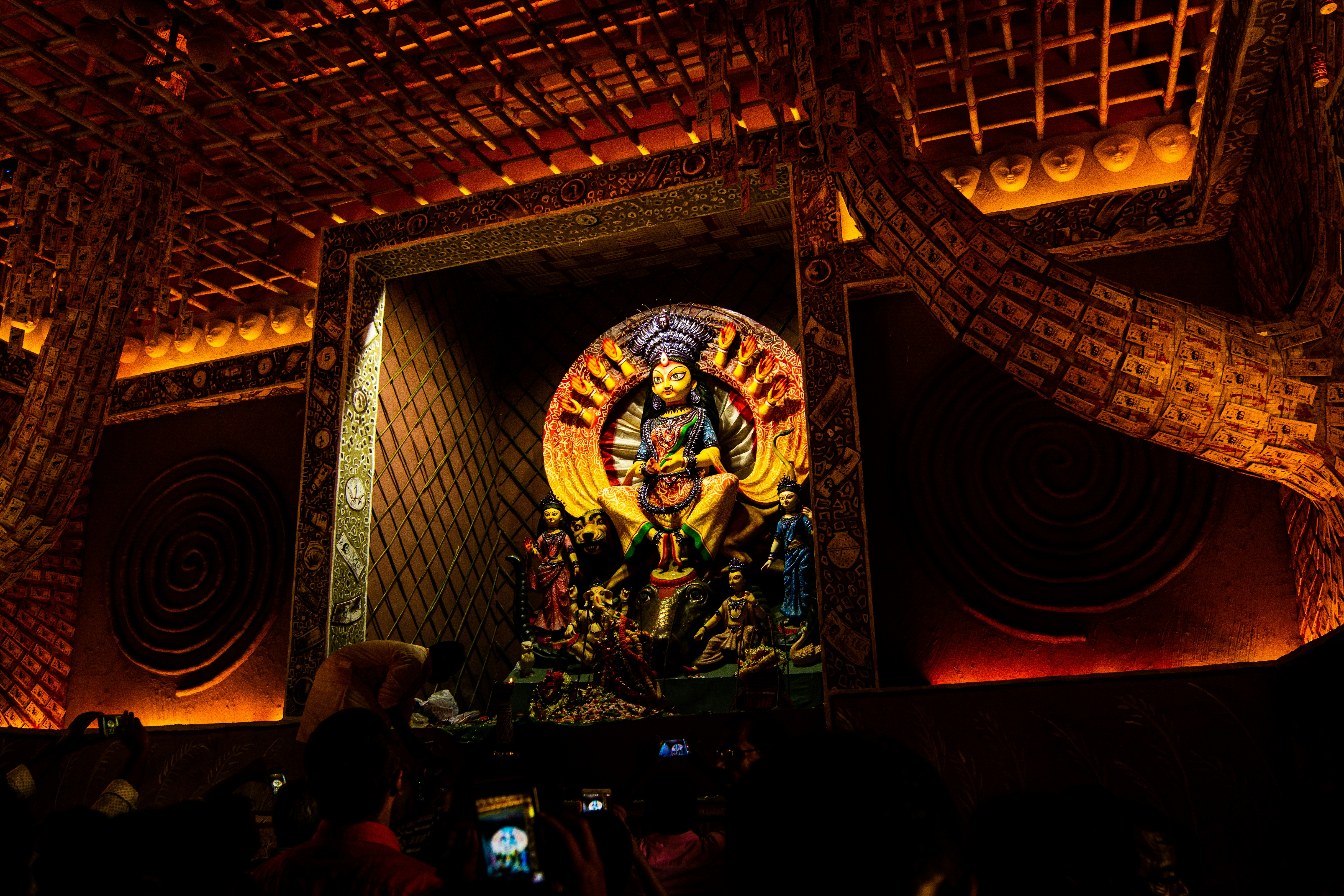 Haloed Bodhisattva Shrine Under Amber Lanterns
