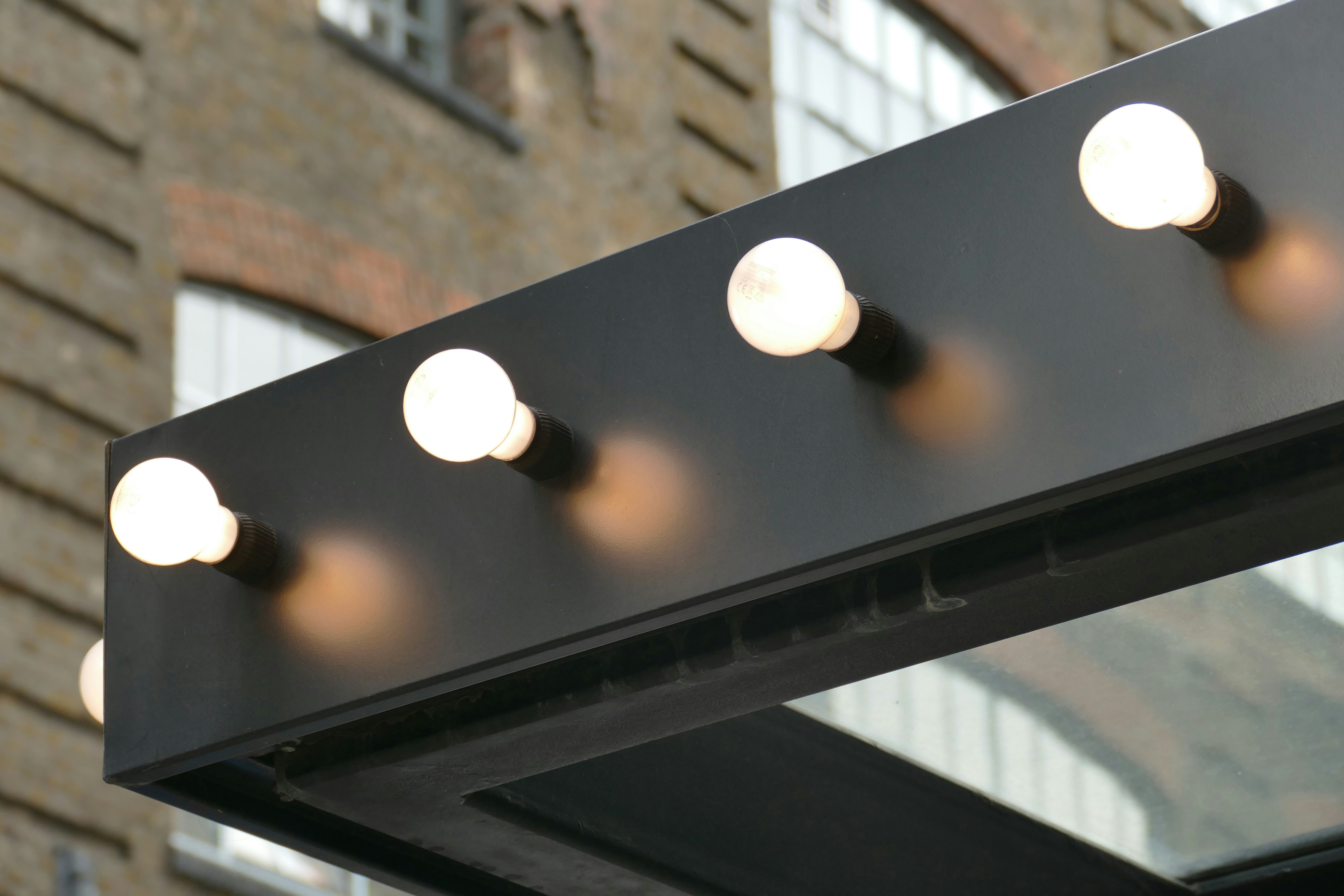 Marquee of Lights Over a Brick Facade