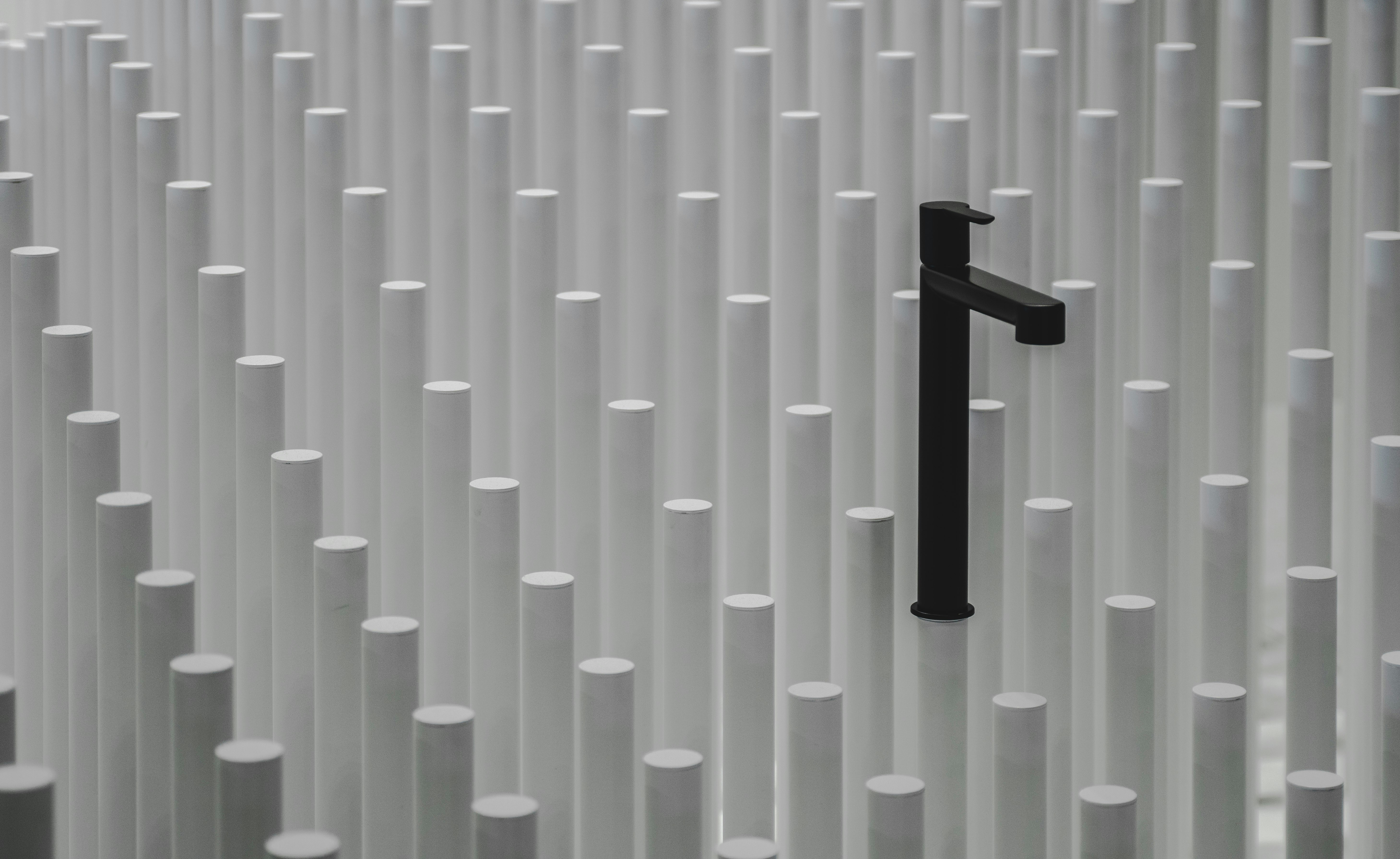 A black number one on a white wall photo – Free Grey Image on Unsplash