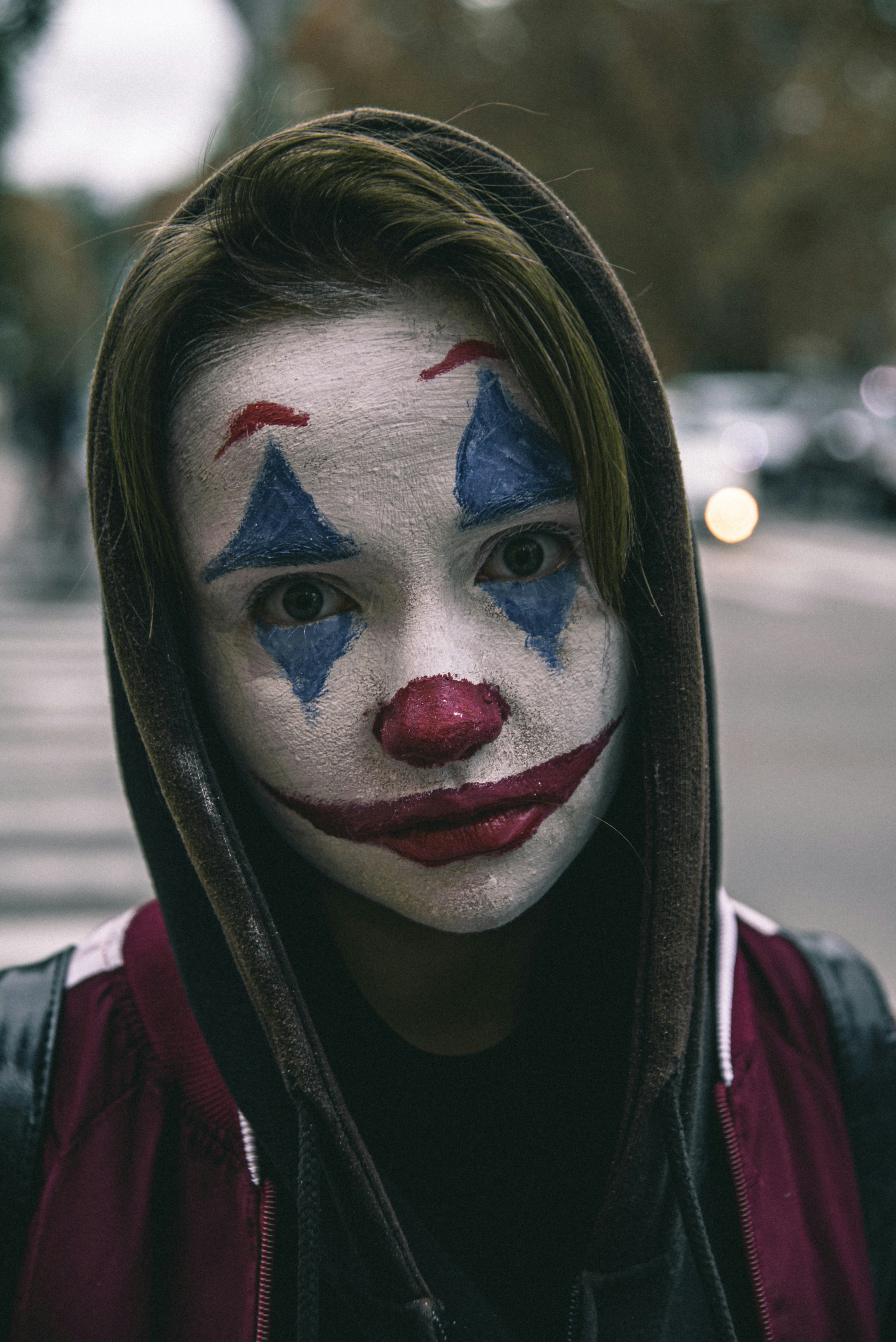 A person with a clown make up on their face photo – Free Grey Image on ...