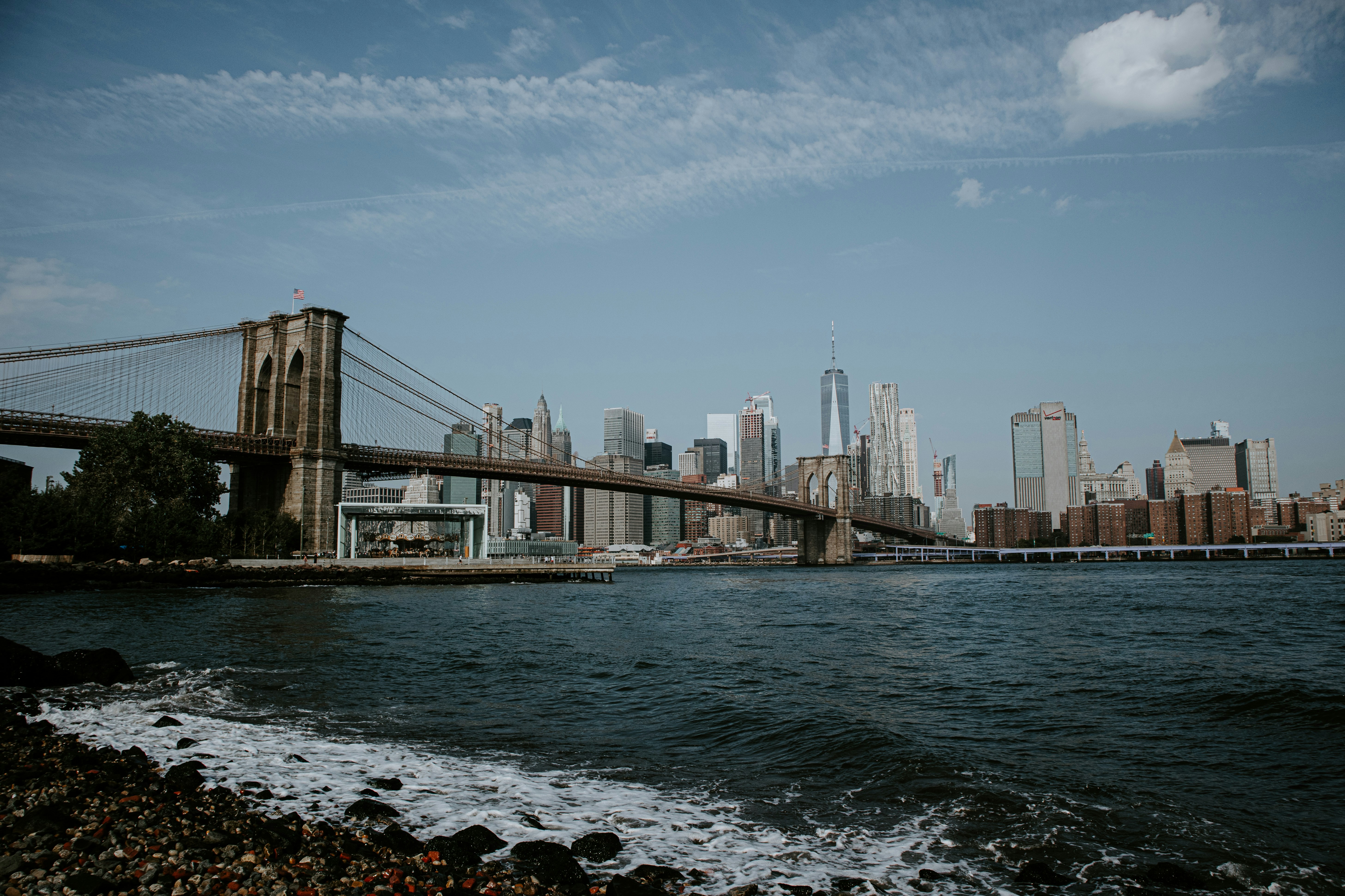 Bridge and Skyline: A Quiet Confluence of Water, Stone, and Steel