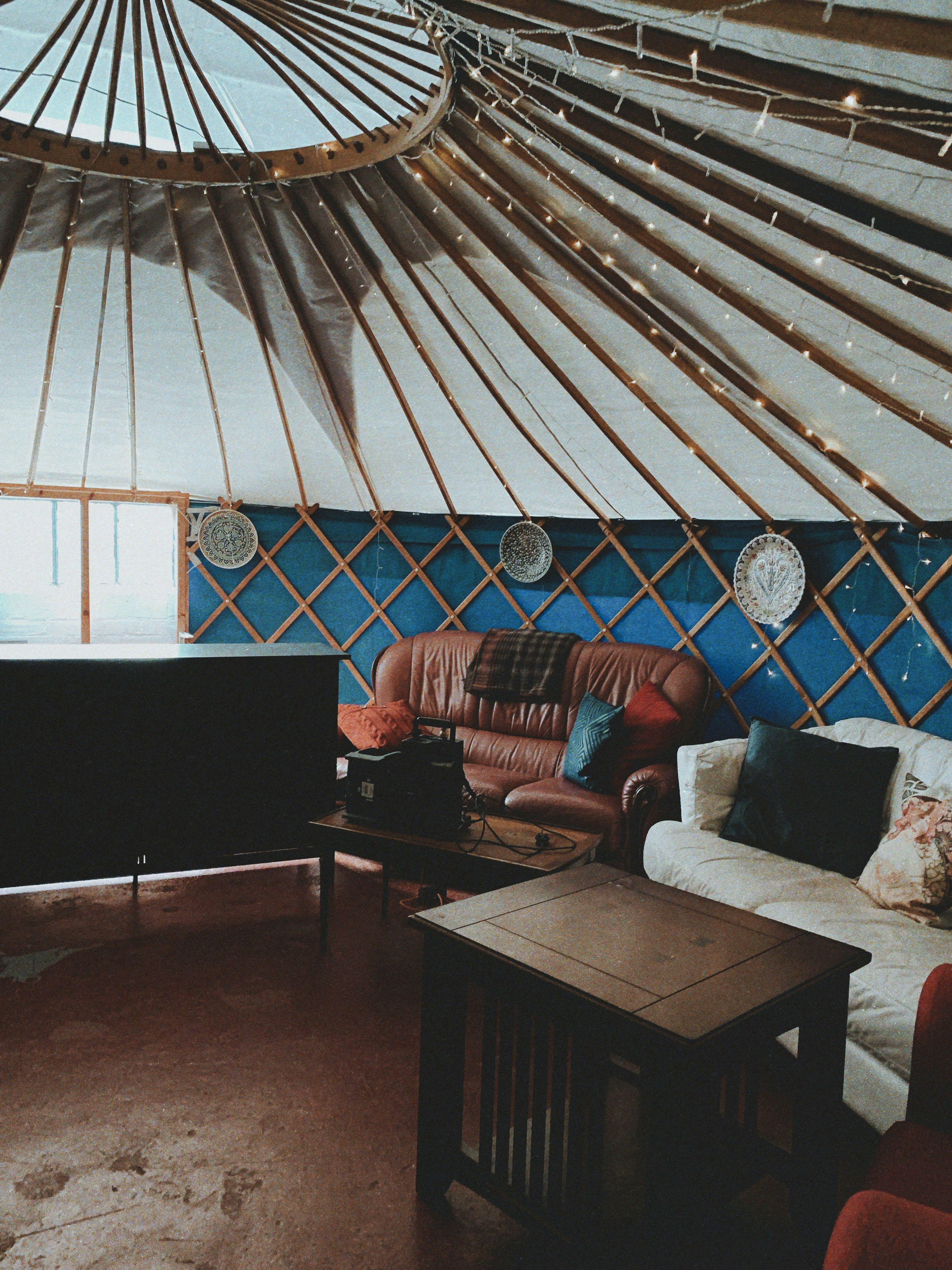 Yurt Lounge: Cozy Seating Beneath a Webbed Roof