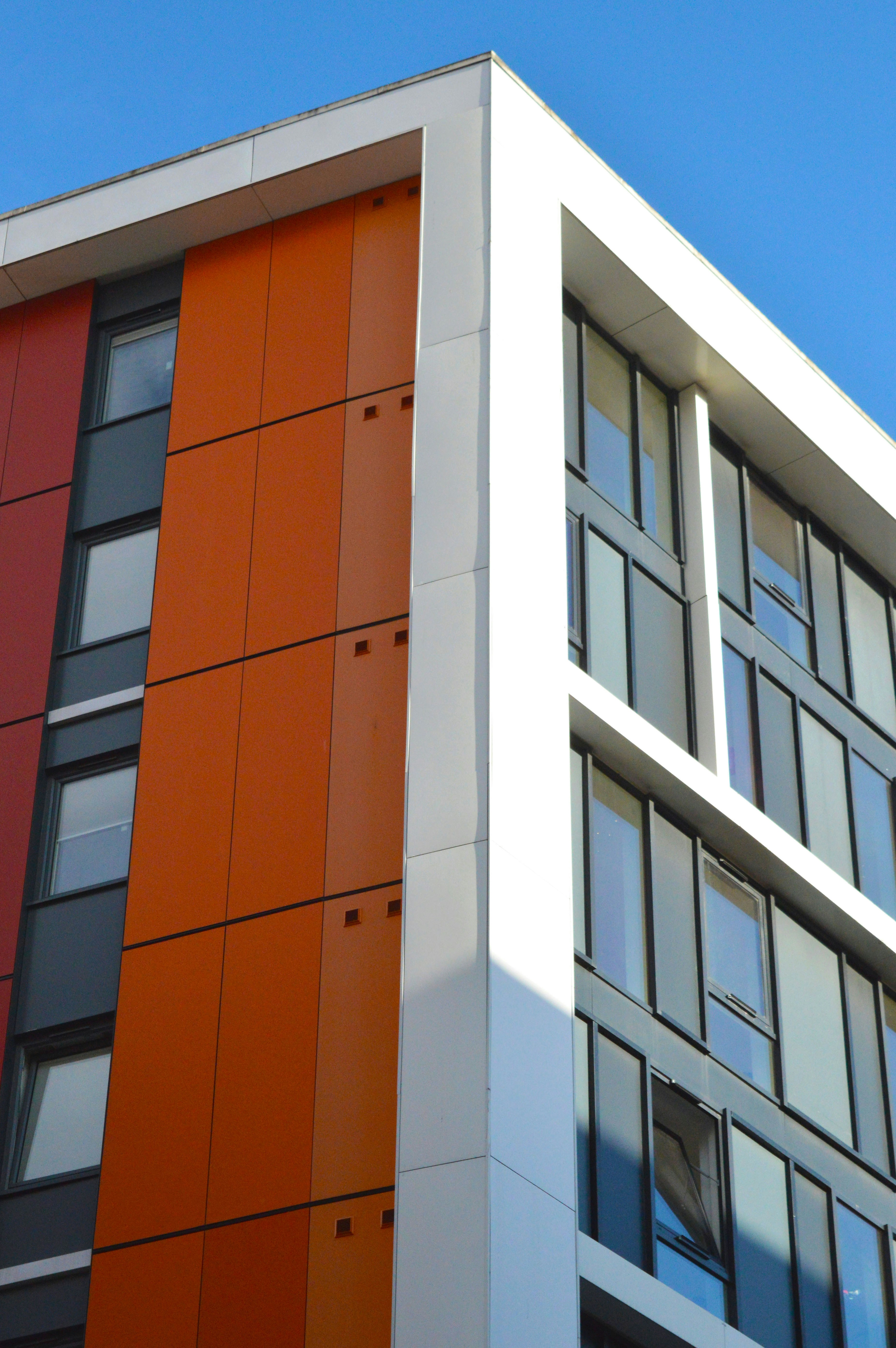 Orange and white high-rise building photo – Free Brown Image on Unsplash