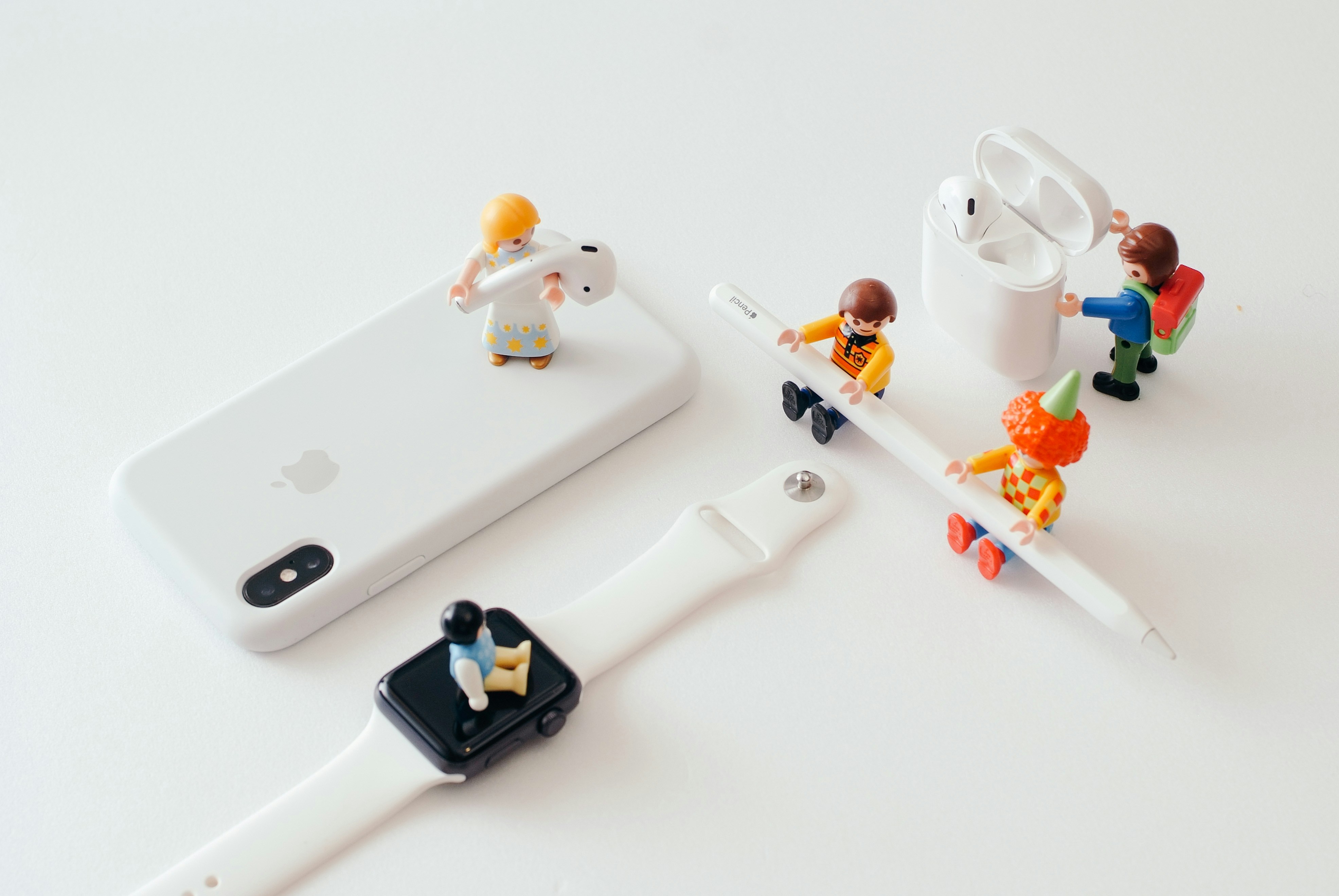 Tiny Tech Figures on a Minimalist White Studio Still Life