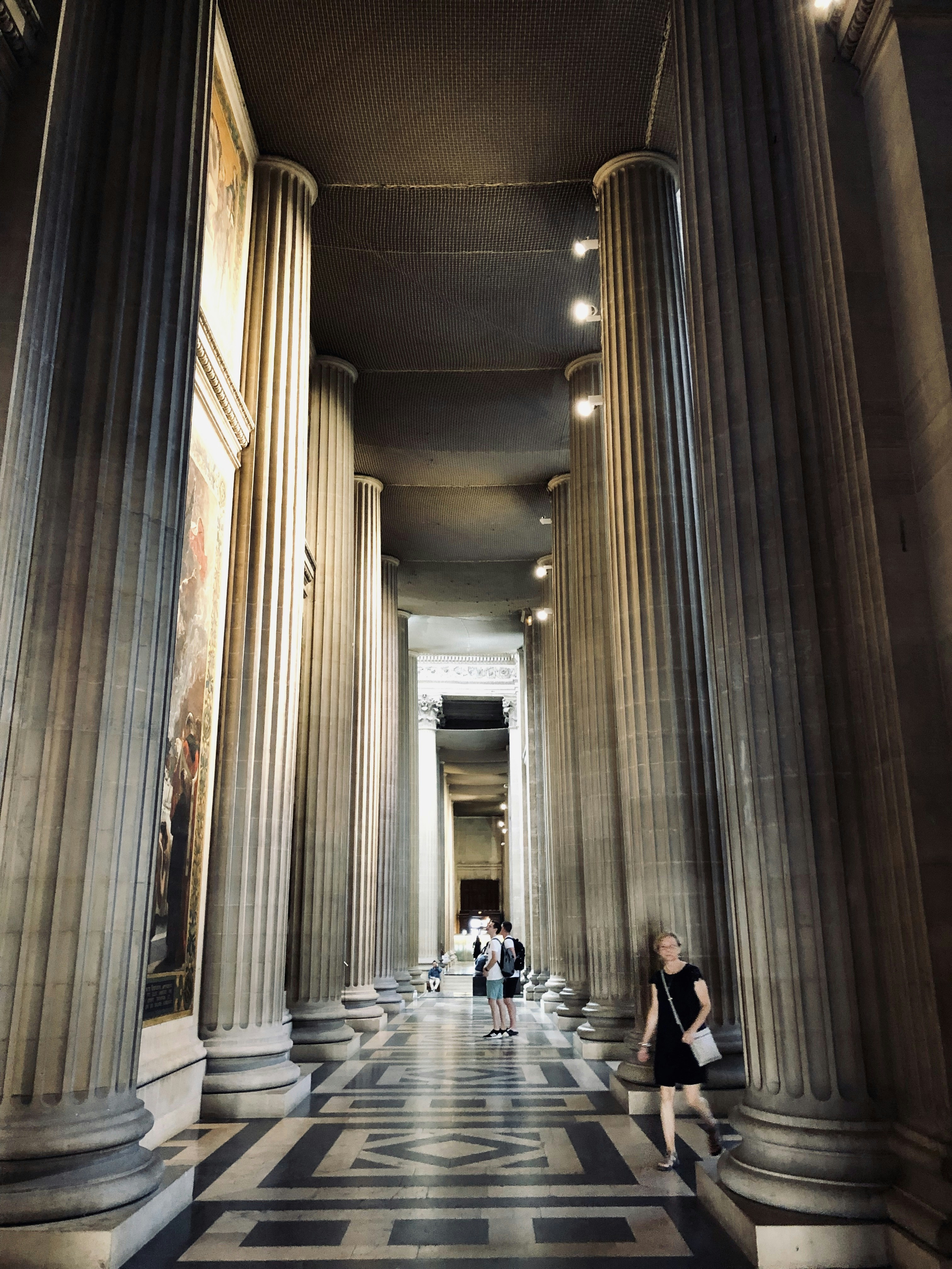 People walking surrounded by concrete pillars photo – Free Paris Image ...