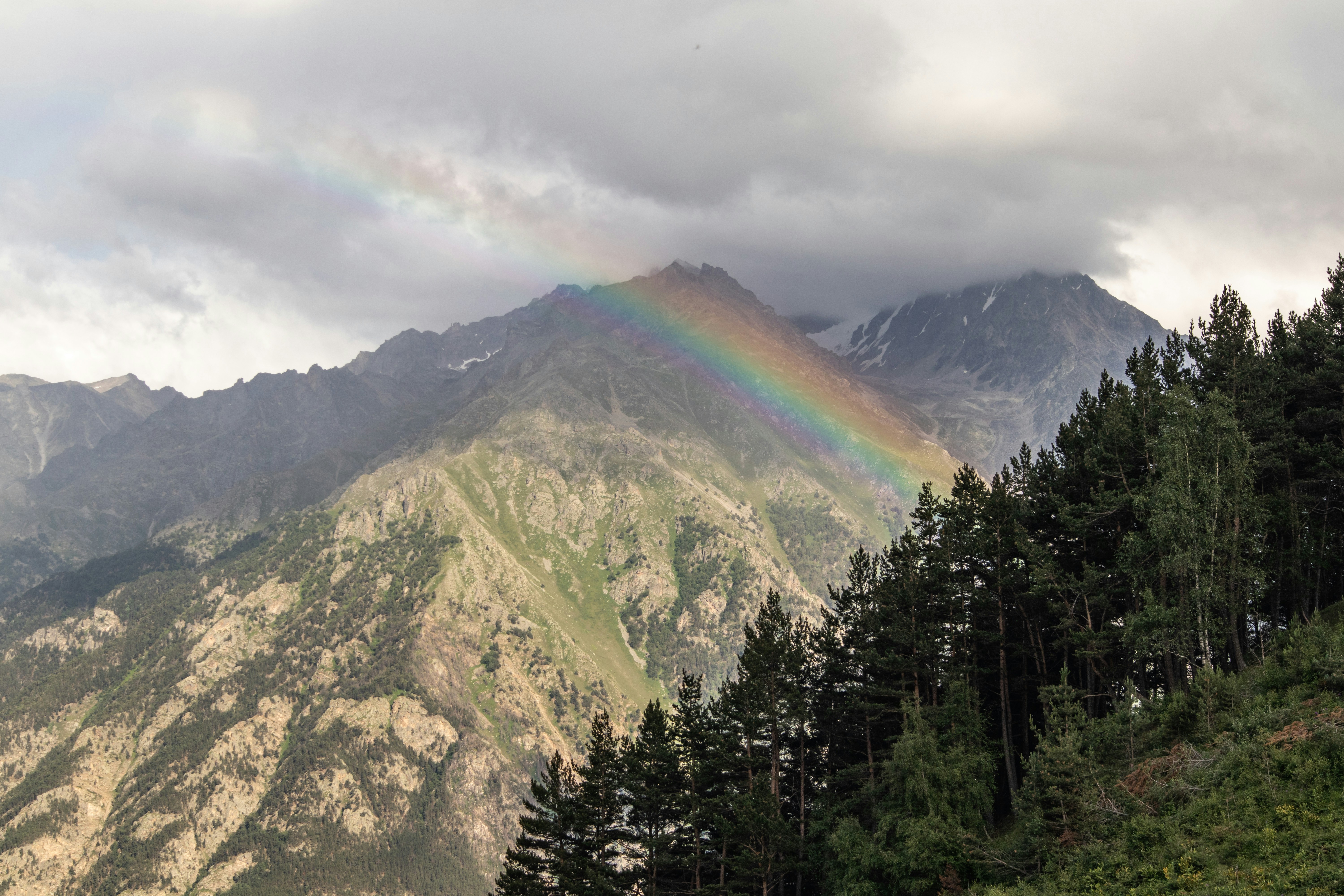 Arc of Colors Over Alpine Peaks