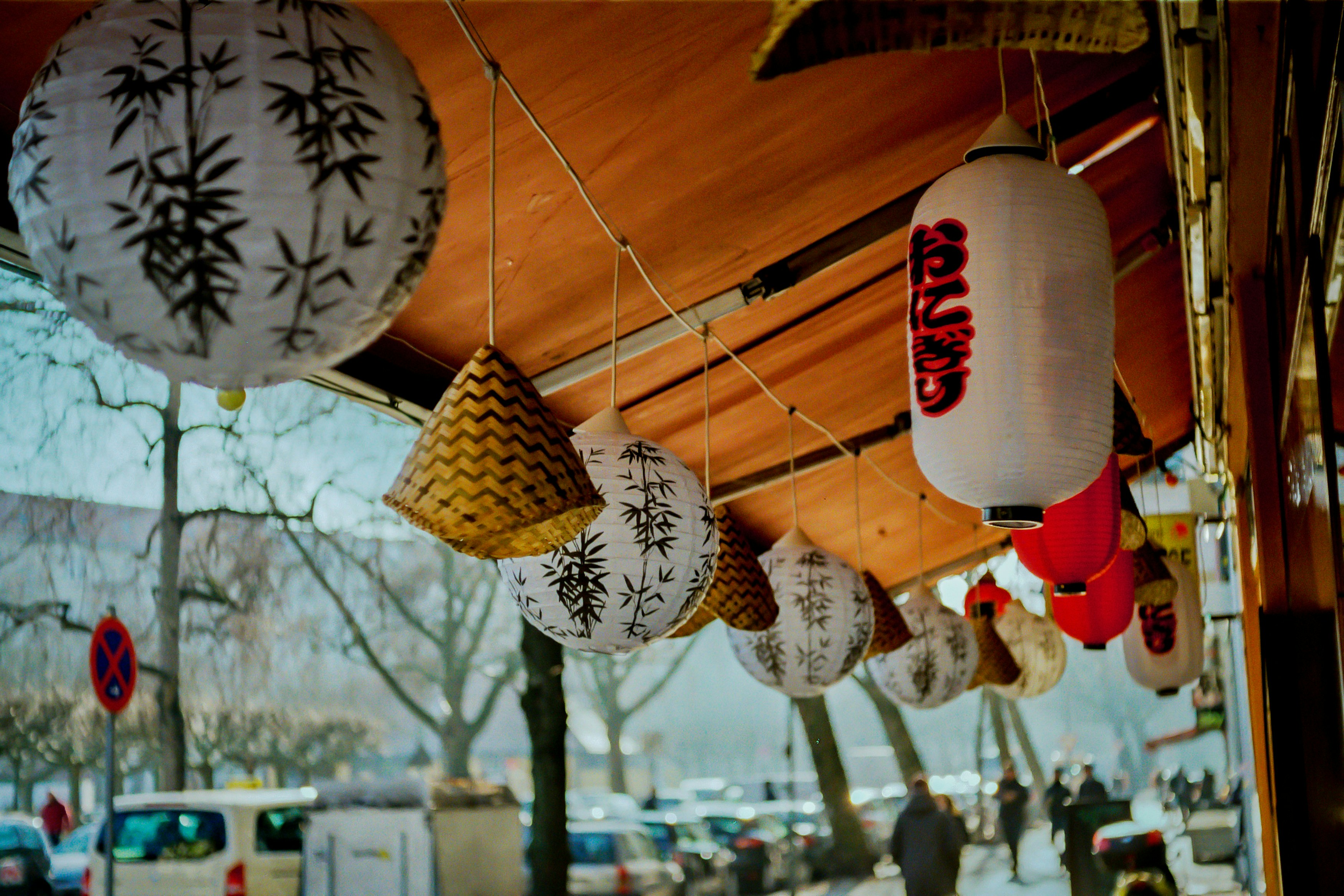 Lanterns Along a Sunlit Arcade: A Quiet Street Festival