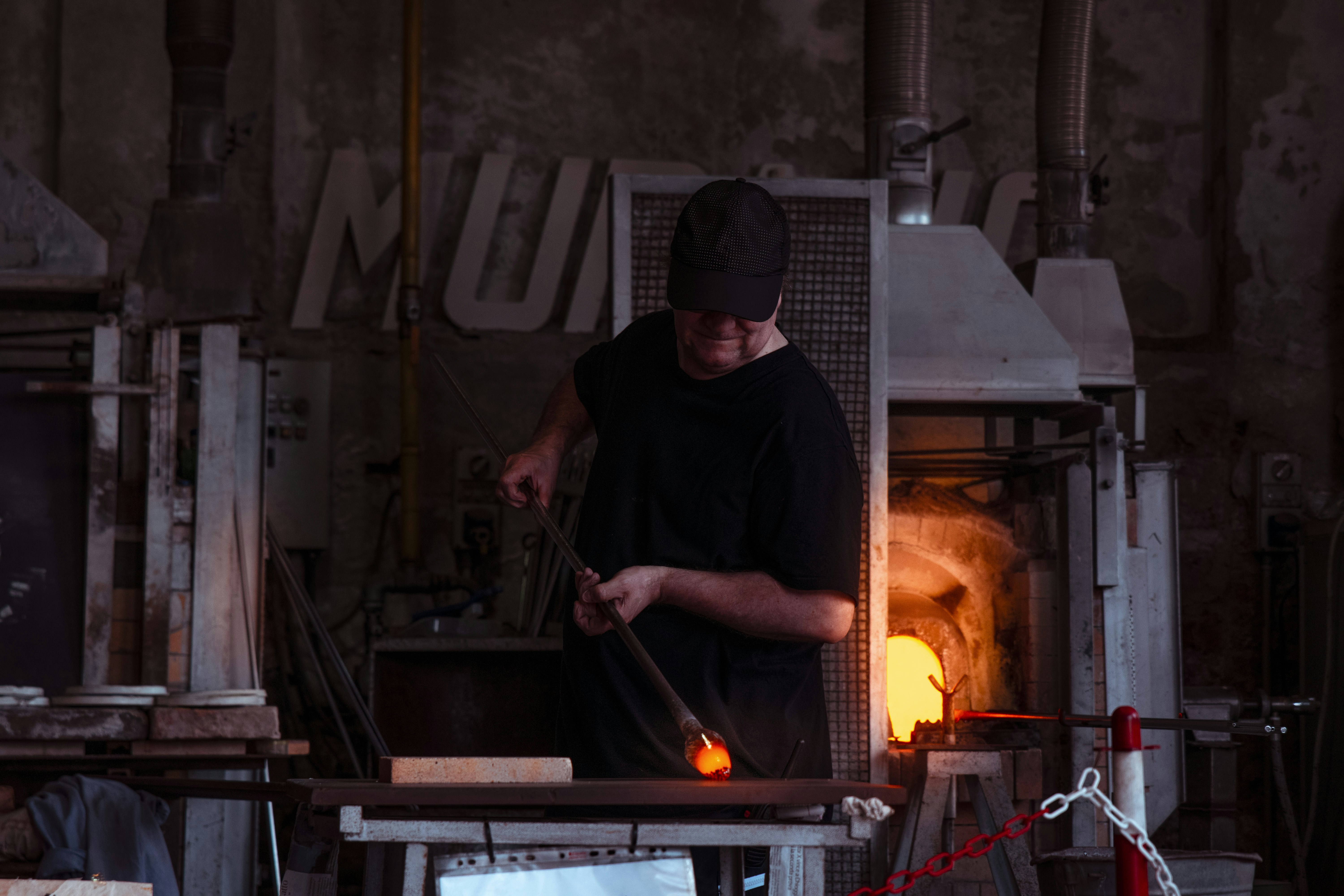 Blacksmith standing at the table photo – Free Glass Image on Unsplash