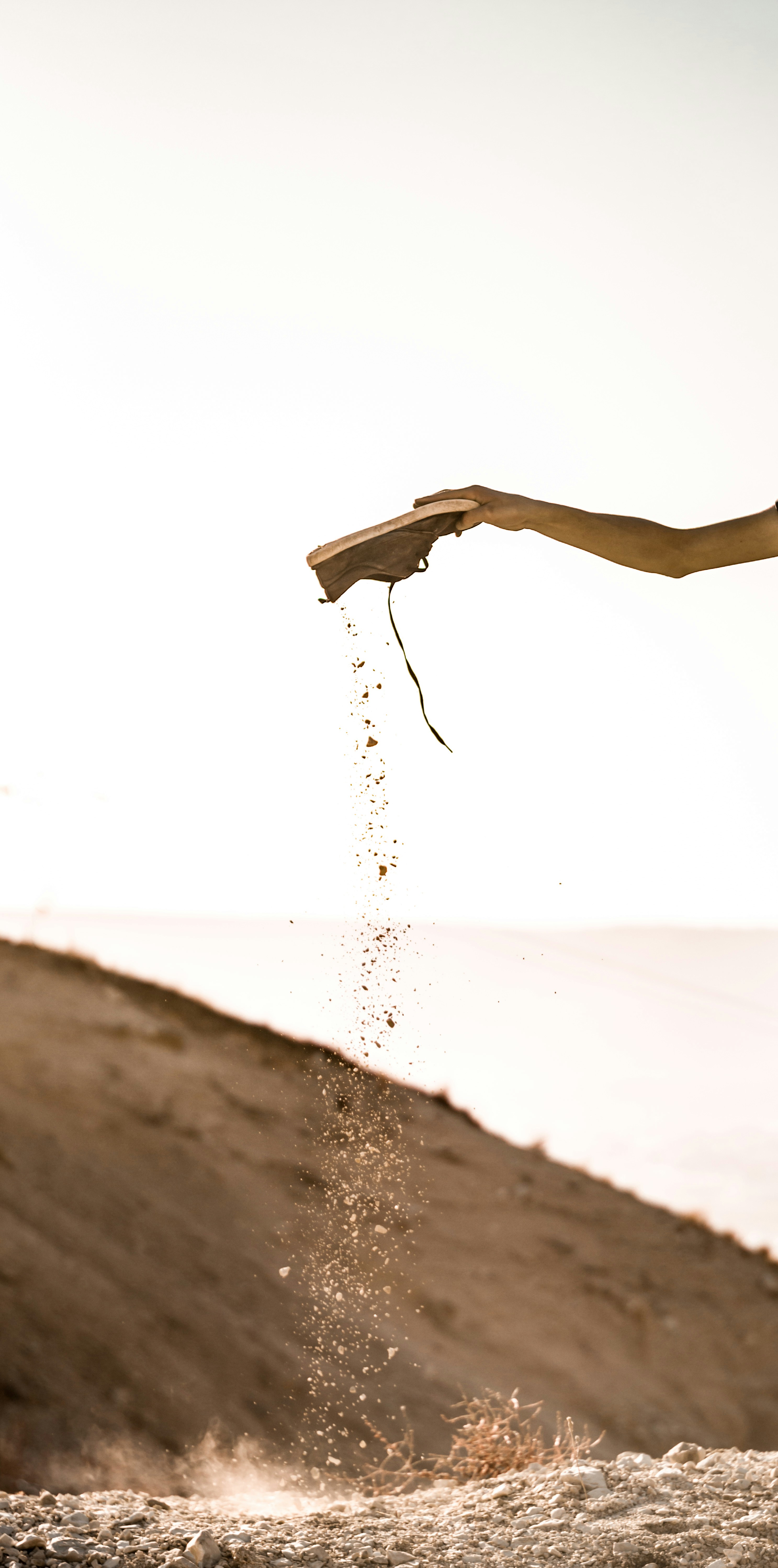 A Moment of Release: Sand Between Fingers