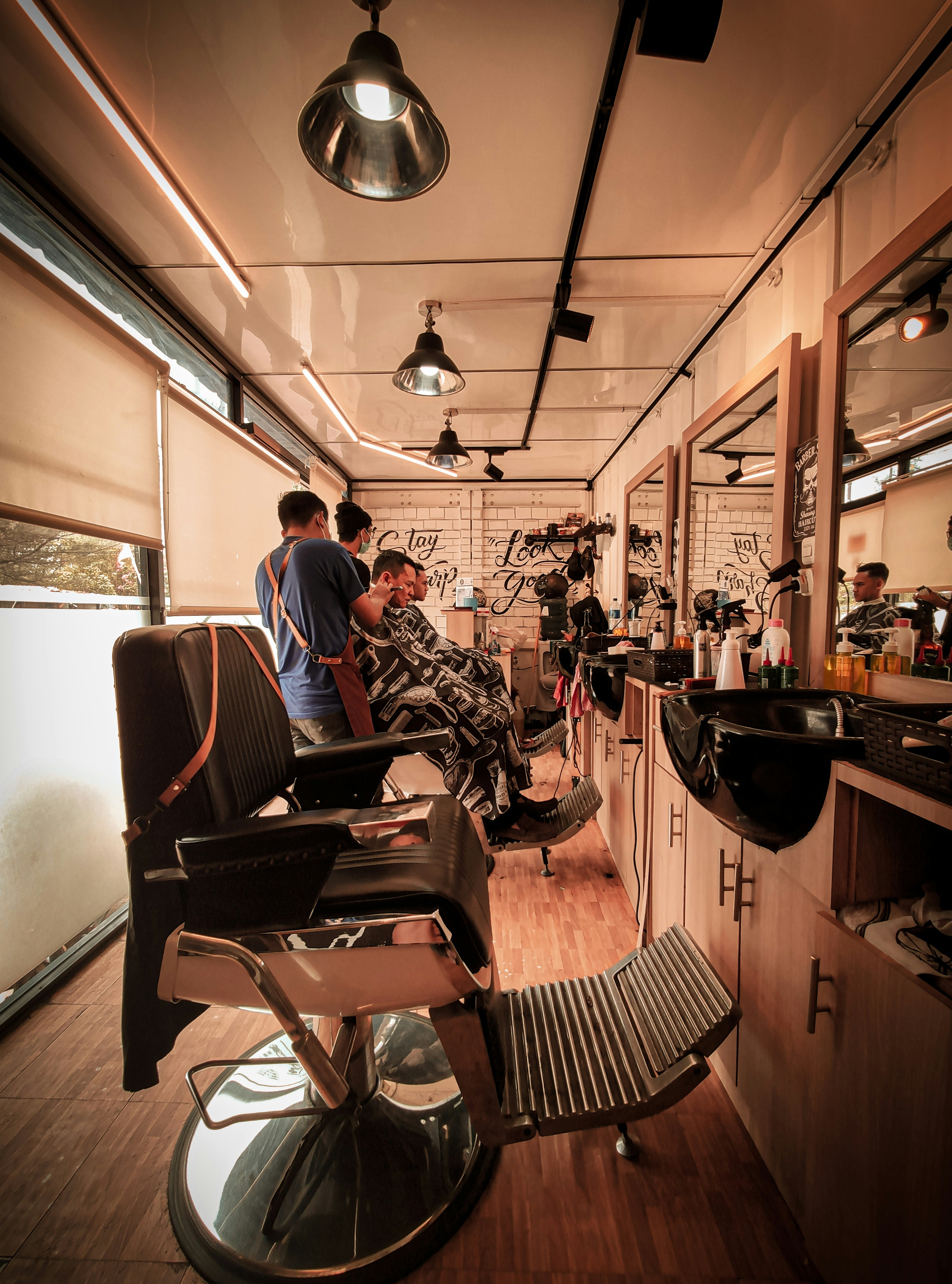 Amber-lit Barbershop on Wheels: A Compact Salon in Action