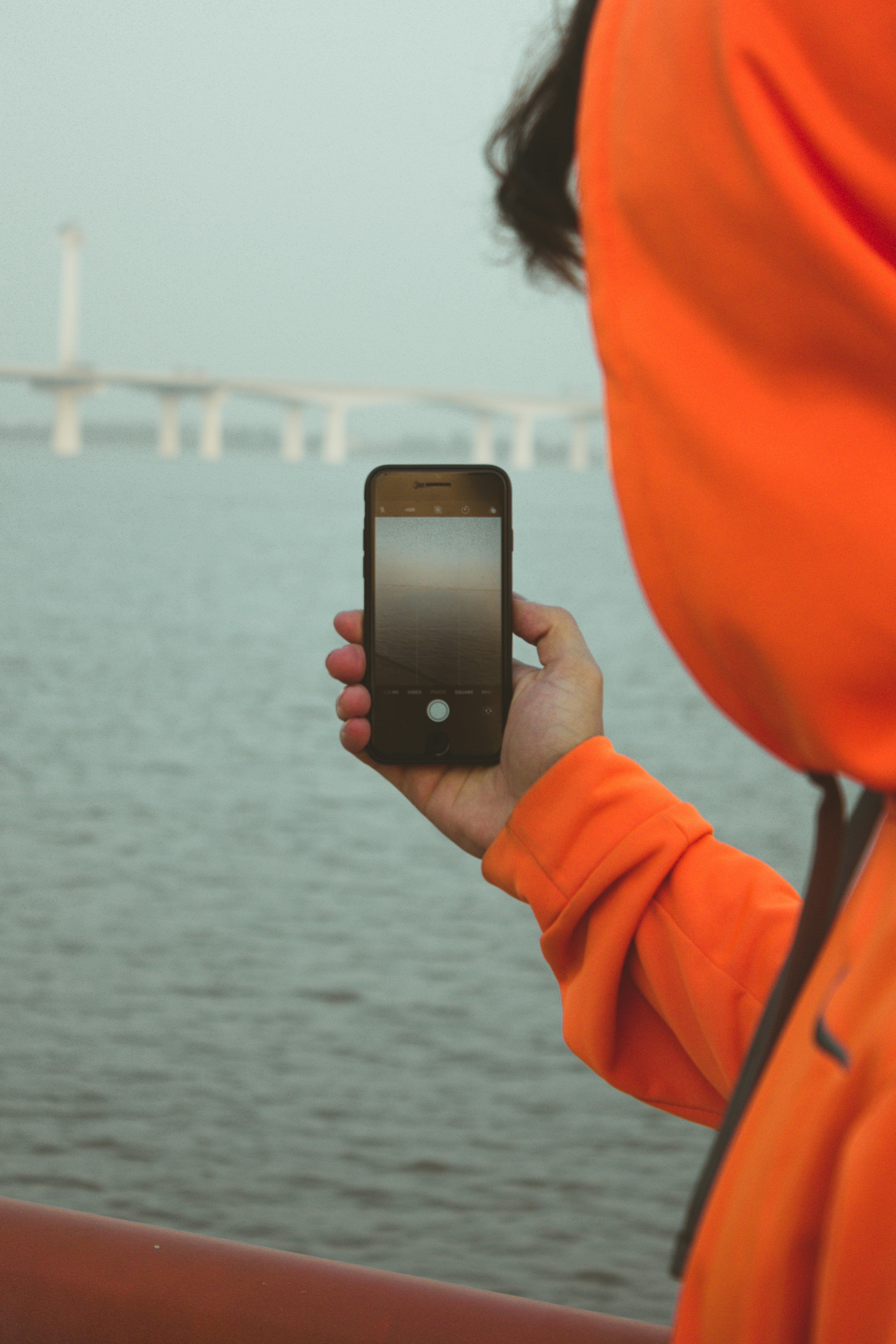 Orange Hoodie Capture: A Handful of Moments with a Phone Glow