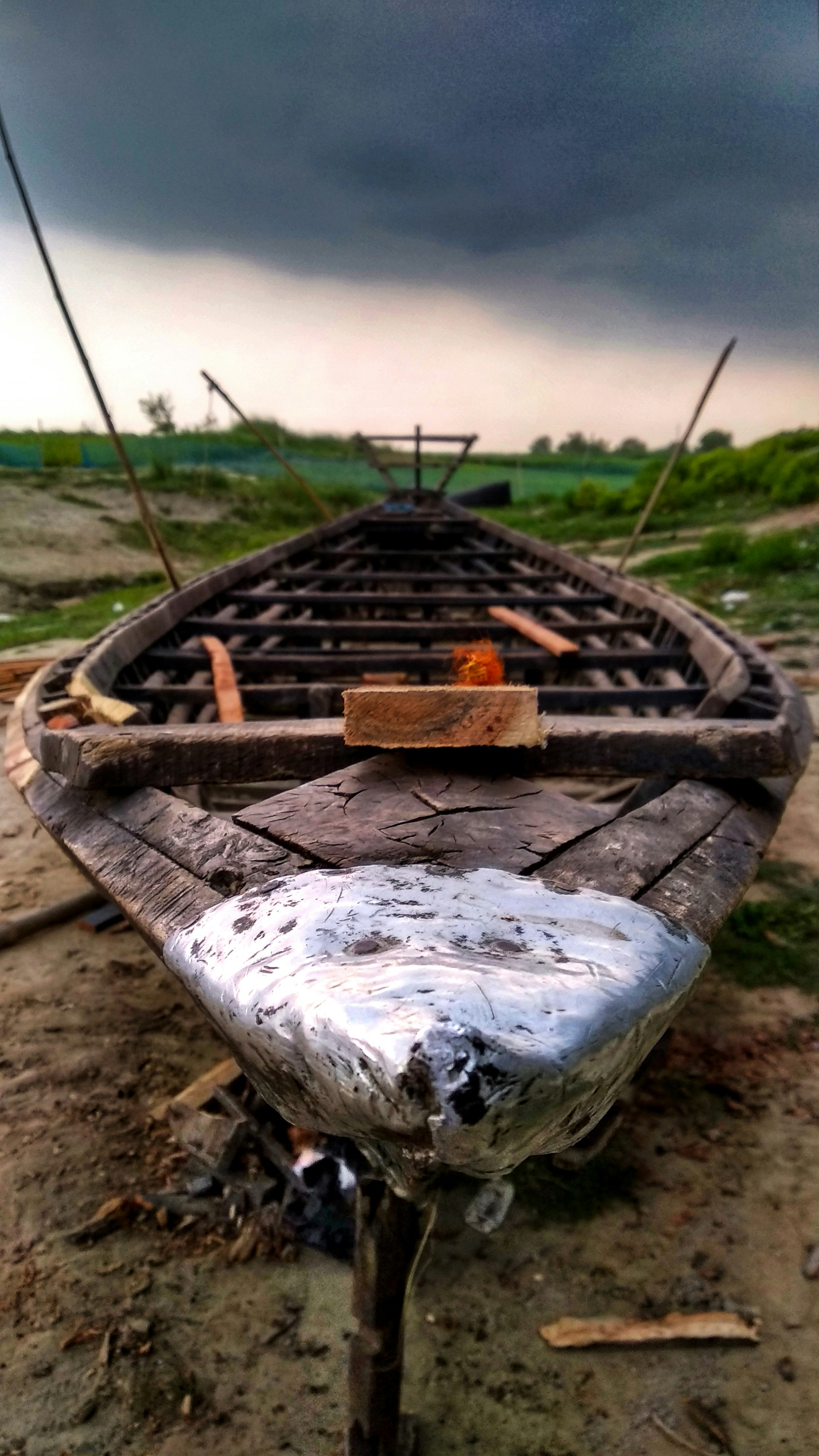 Weathered Bow Extending Toward a Looming Storm
